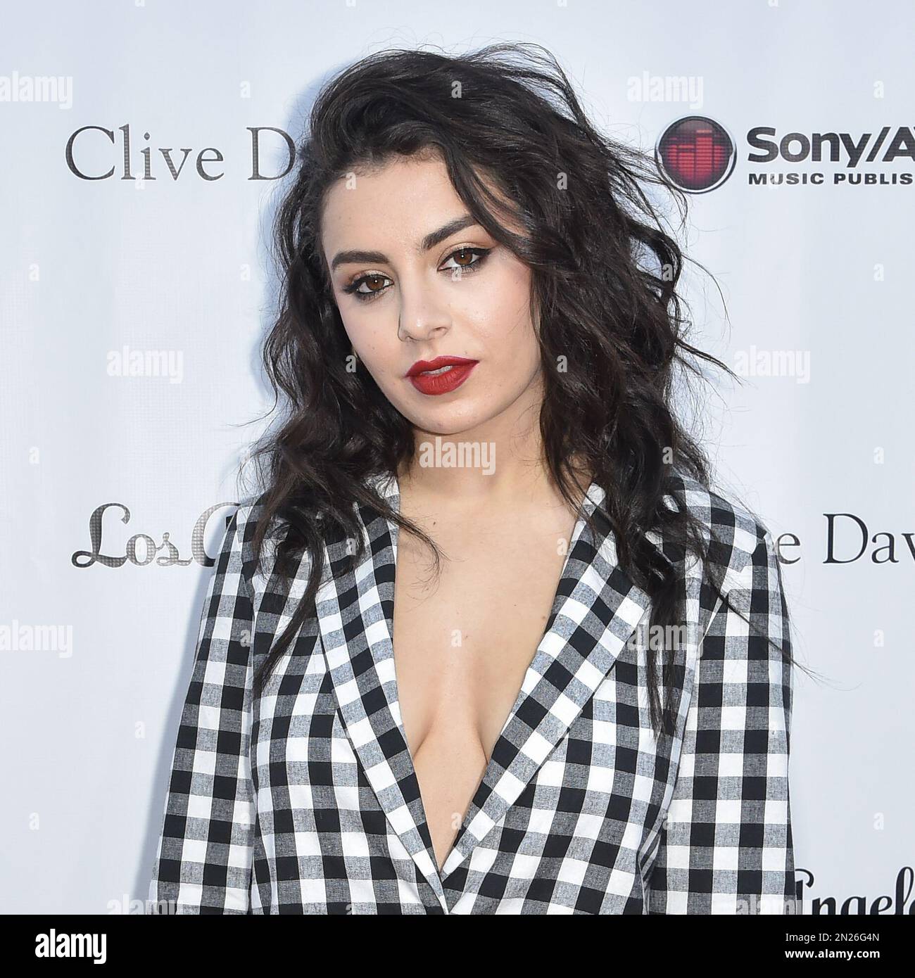 Charli XCX arrives at the 11th annual Songs Of Hope benefit on Thursday ...