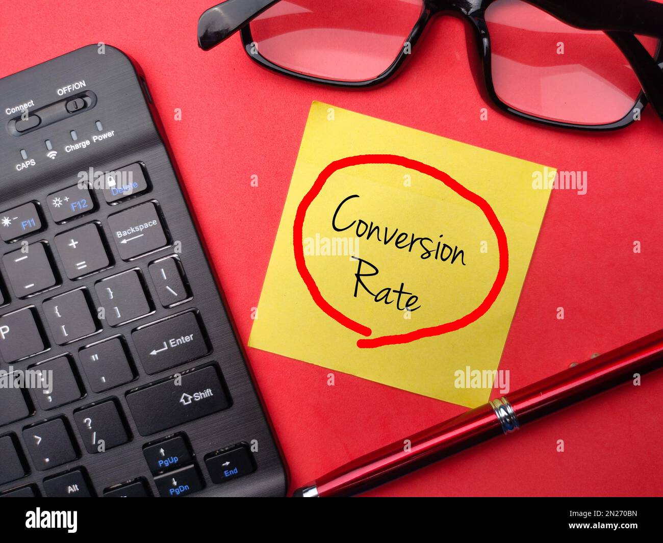 Keyboard and pencil with the word Conversion Rate. Business concept ...