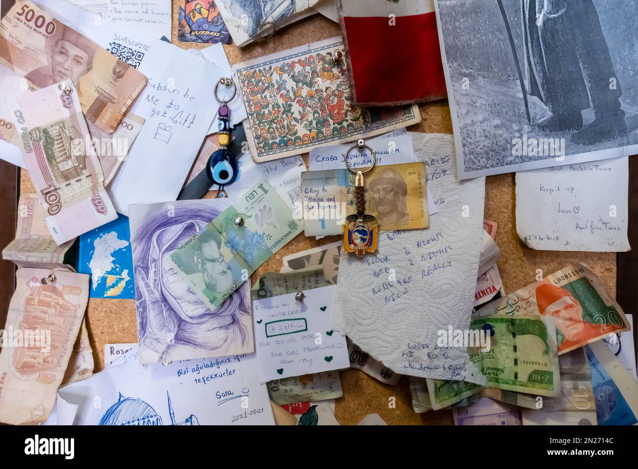 Pinned notes wishes, money, banknote, banknotes, messages on a wall of ...