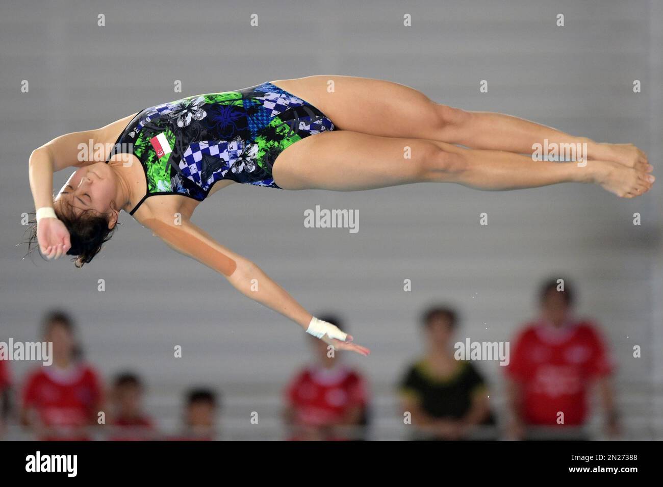 Frieda Lim of Singapore dives in the women's 10-meter platform final at ...