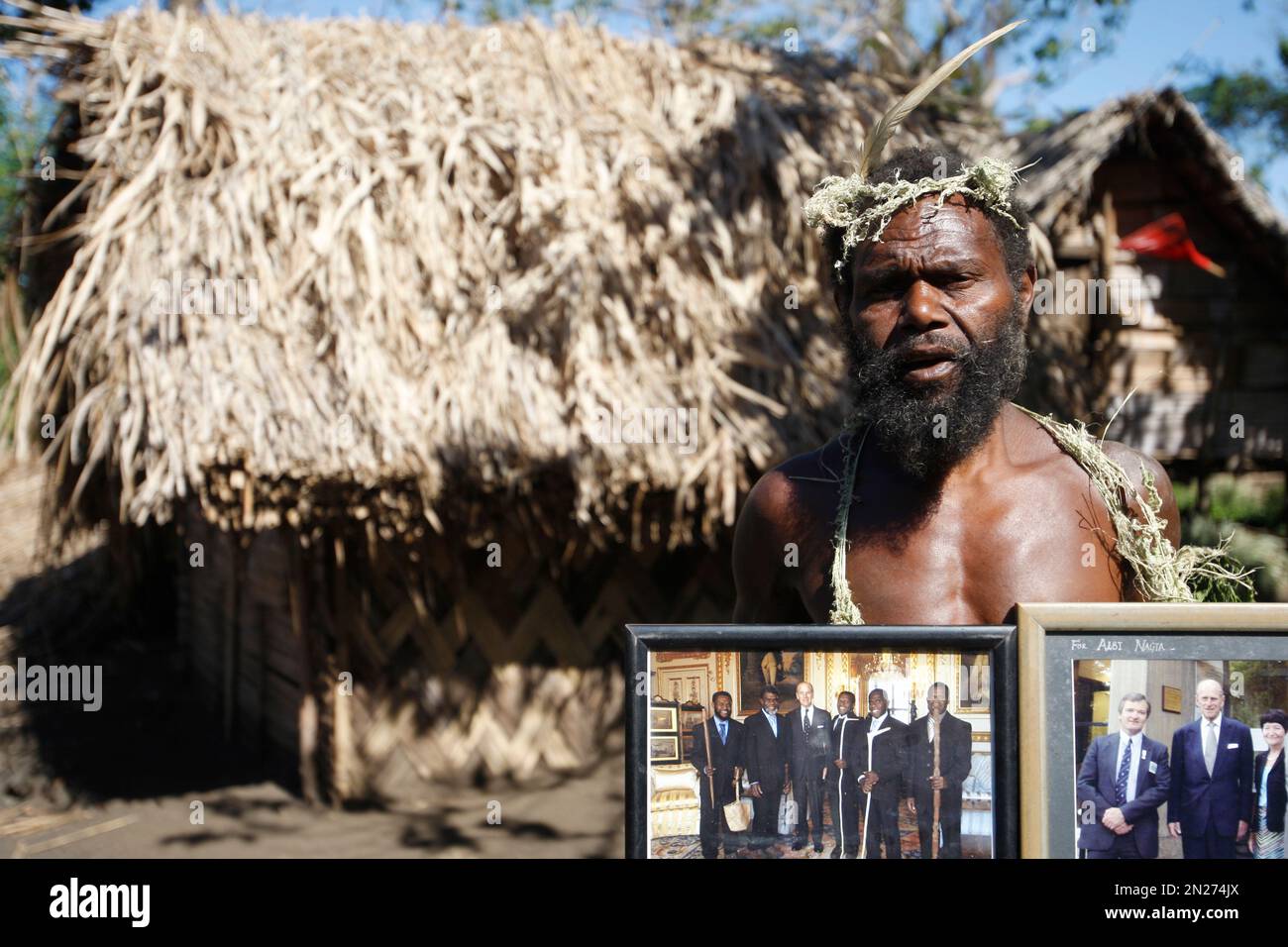 In this Sunday, May 31, 2015 photo, Albi Nagia poses with photographs ...