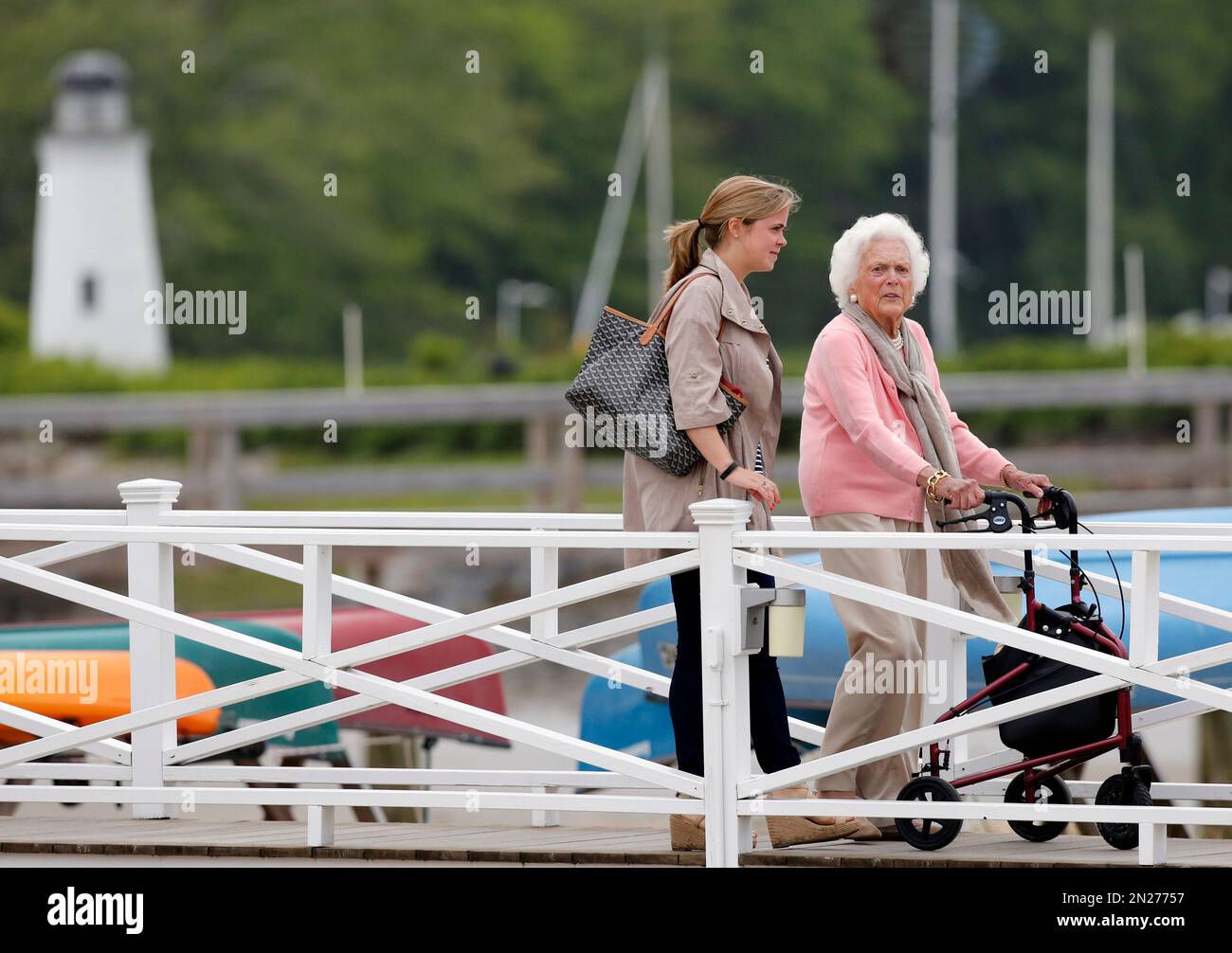 Former first lady Barbara Bush uses a walker as she leaves a luncheon ...