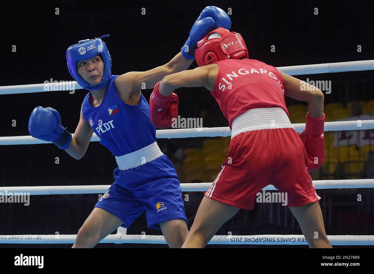 Philippines' Josie Gabuco, left, fights Singapore's Leona Hui during ...