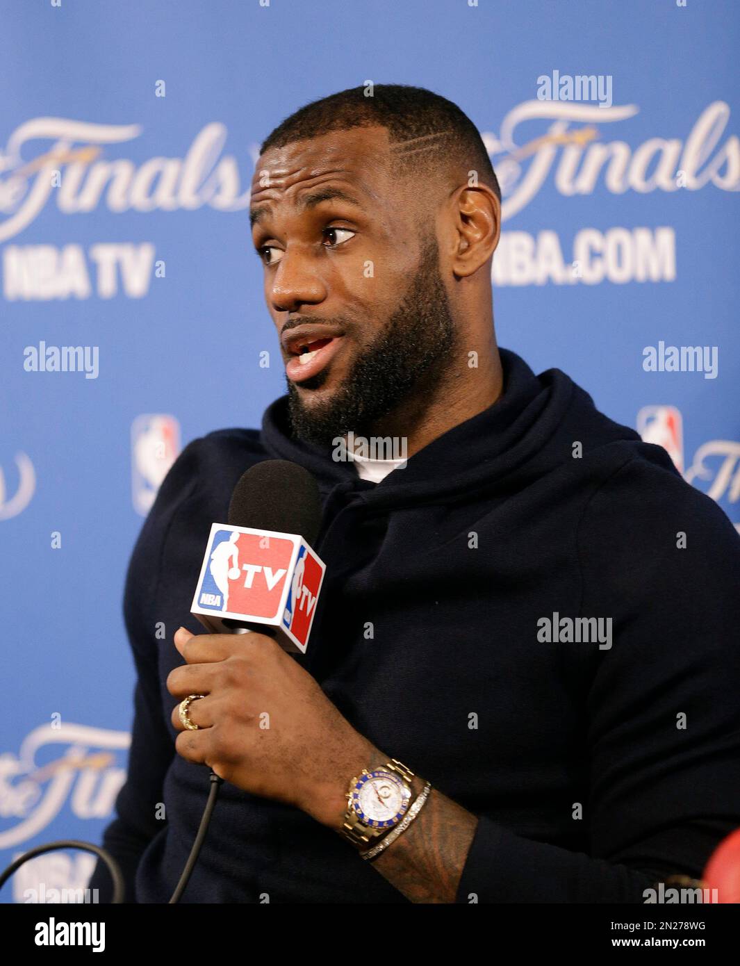 Cleveland Cavaliers forward LeBron James answers questions during a ...
