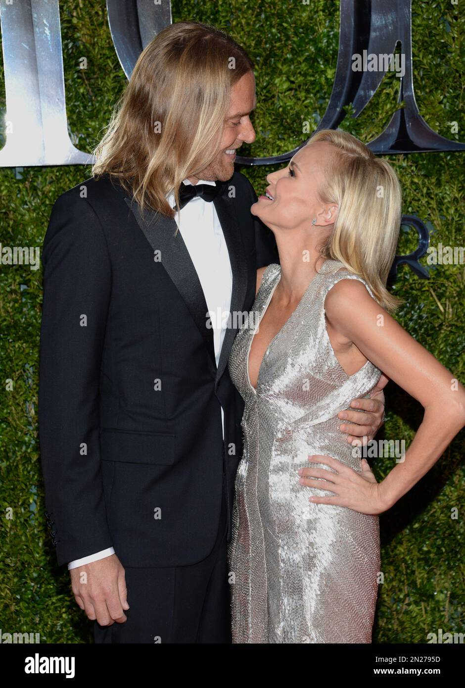 Andrew Pruett, left, and Kristin Chenoweth arrive at the 69th annual ...
