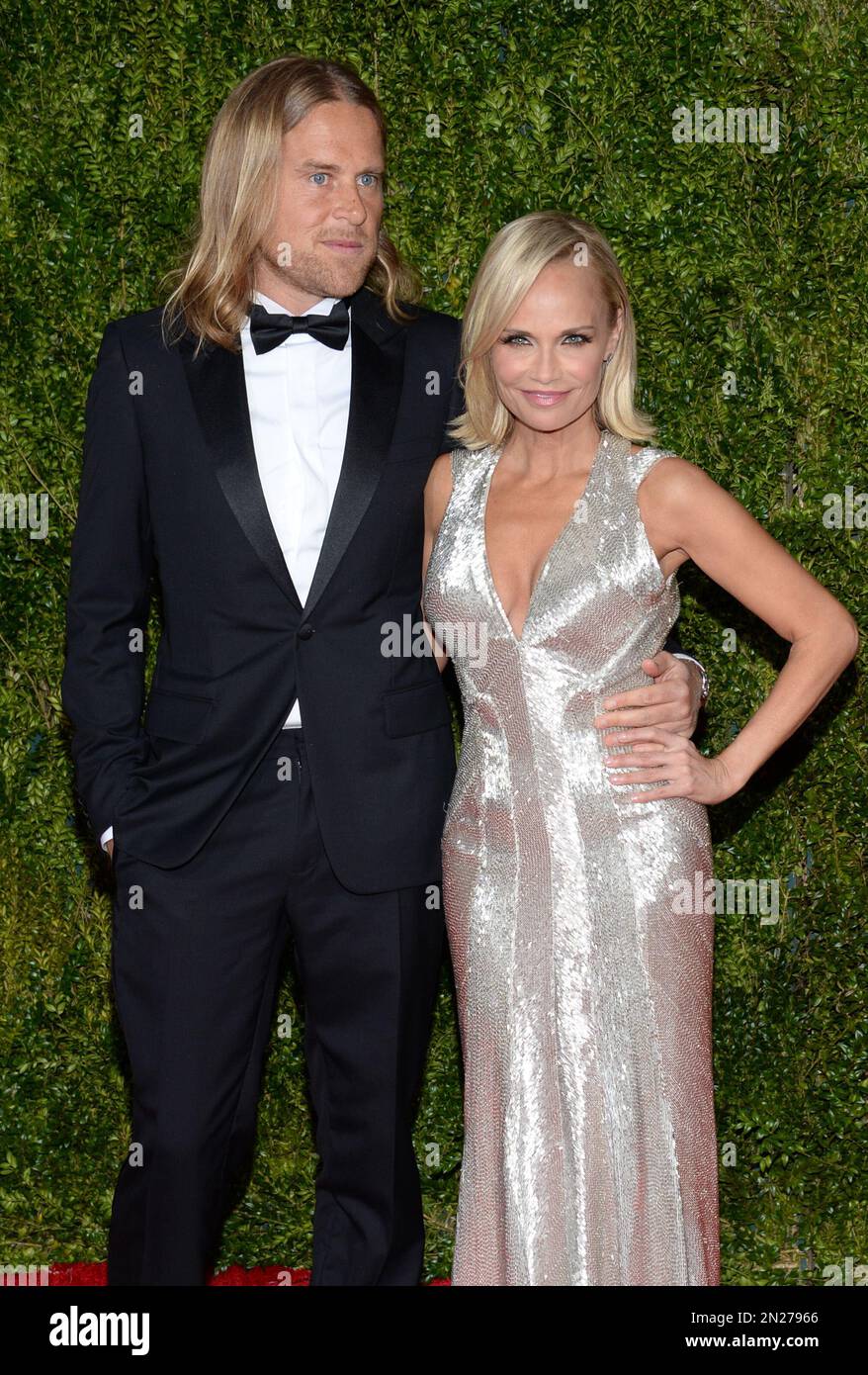 Andrew Pruett, left, and Kristin Chenoweth arrive at the 69th annual ...