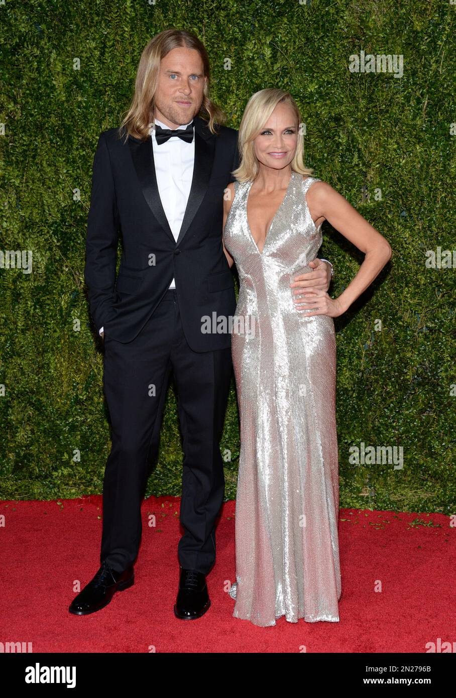 Andrew Pruett, left, and Kristin Chenoweth arrive at the 69th annual ...
