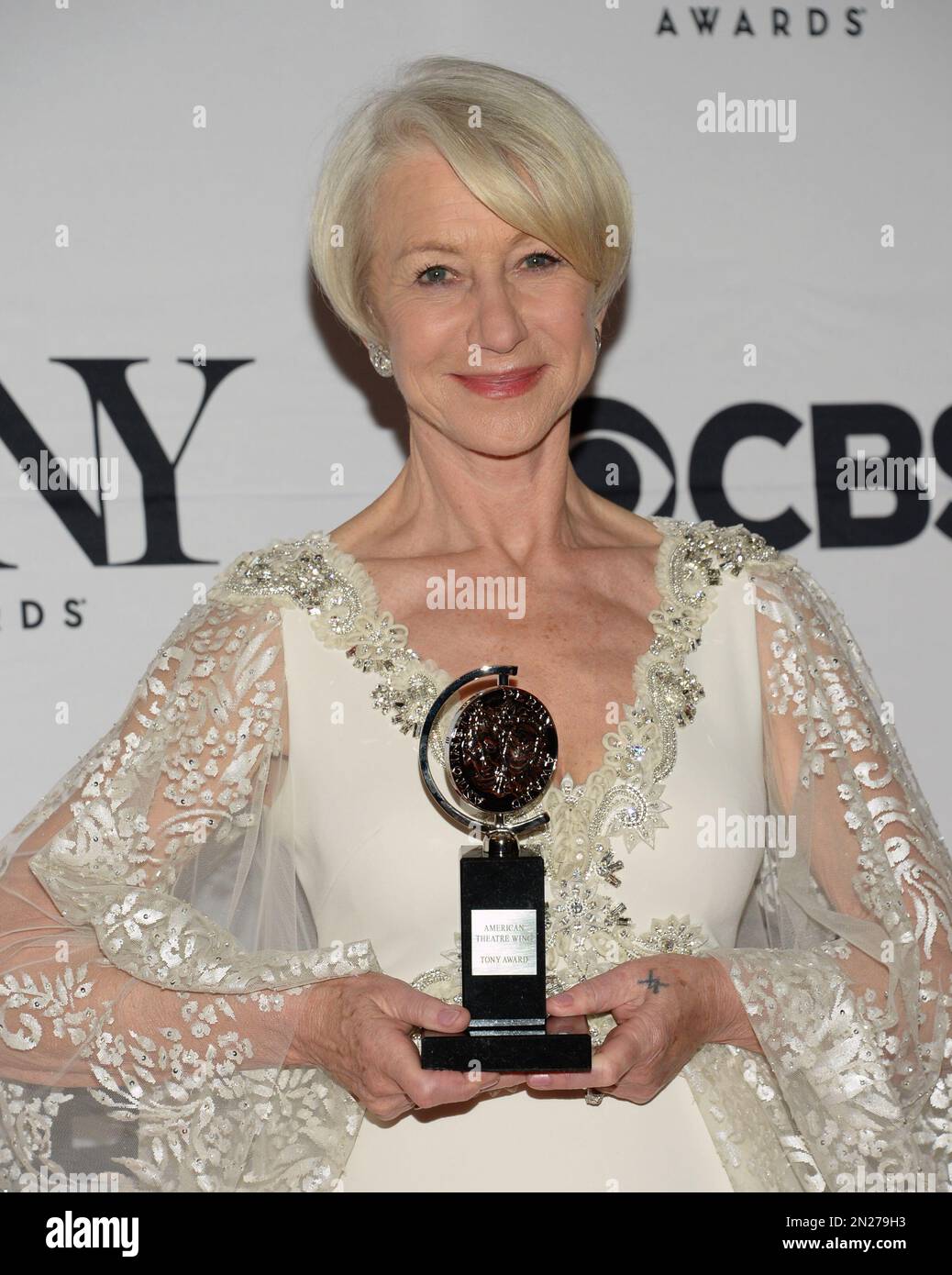 Helen Mirren poses in the press room with the award for best ...