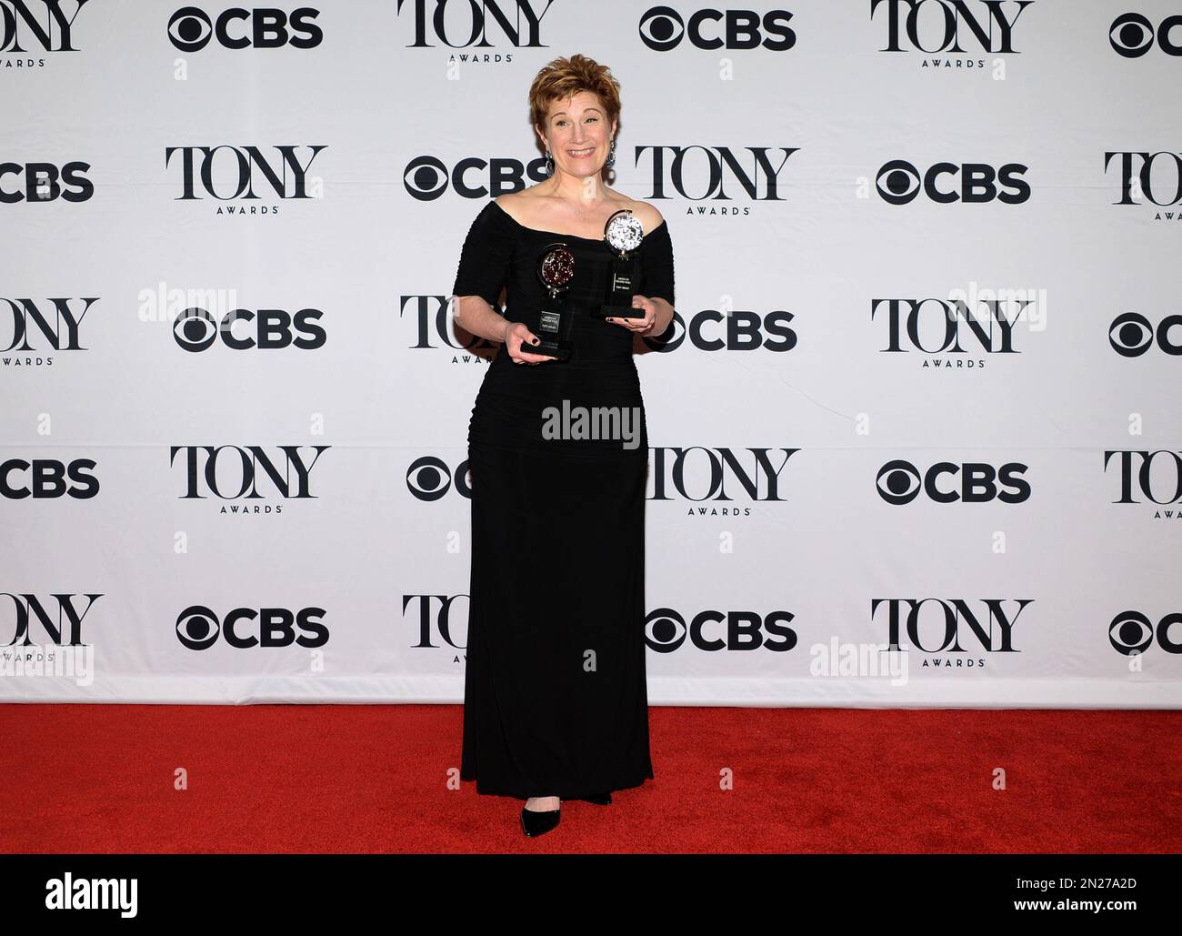 Lisa Kron poses with the award for best book for “Fun Home” in the ...