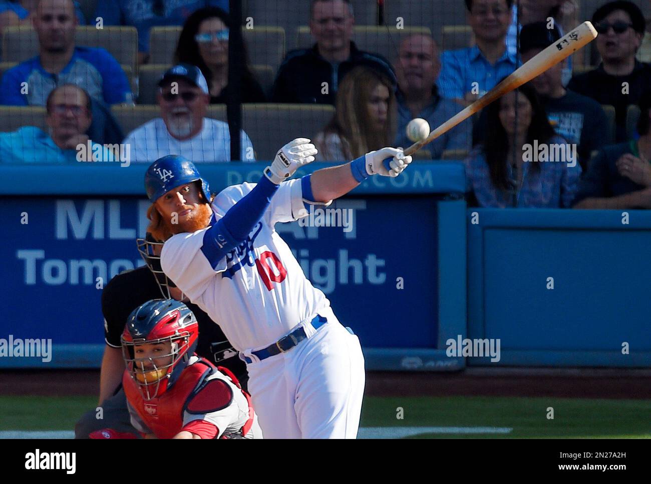 Los Angeles Dodgers' Justin Turner, right, hits an RBI double as St ...