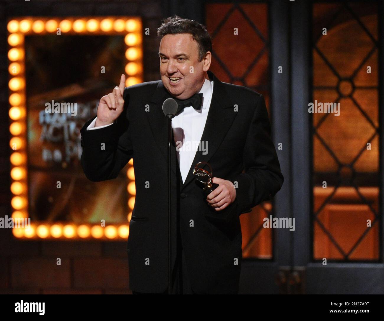 Richard McCabe accepts the award for best performance by an actor in a ...