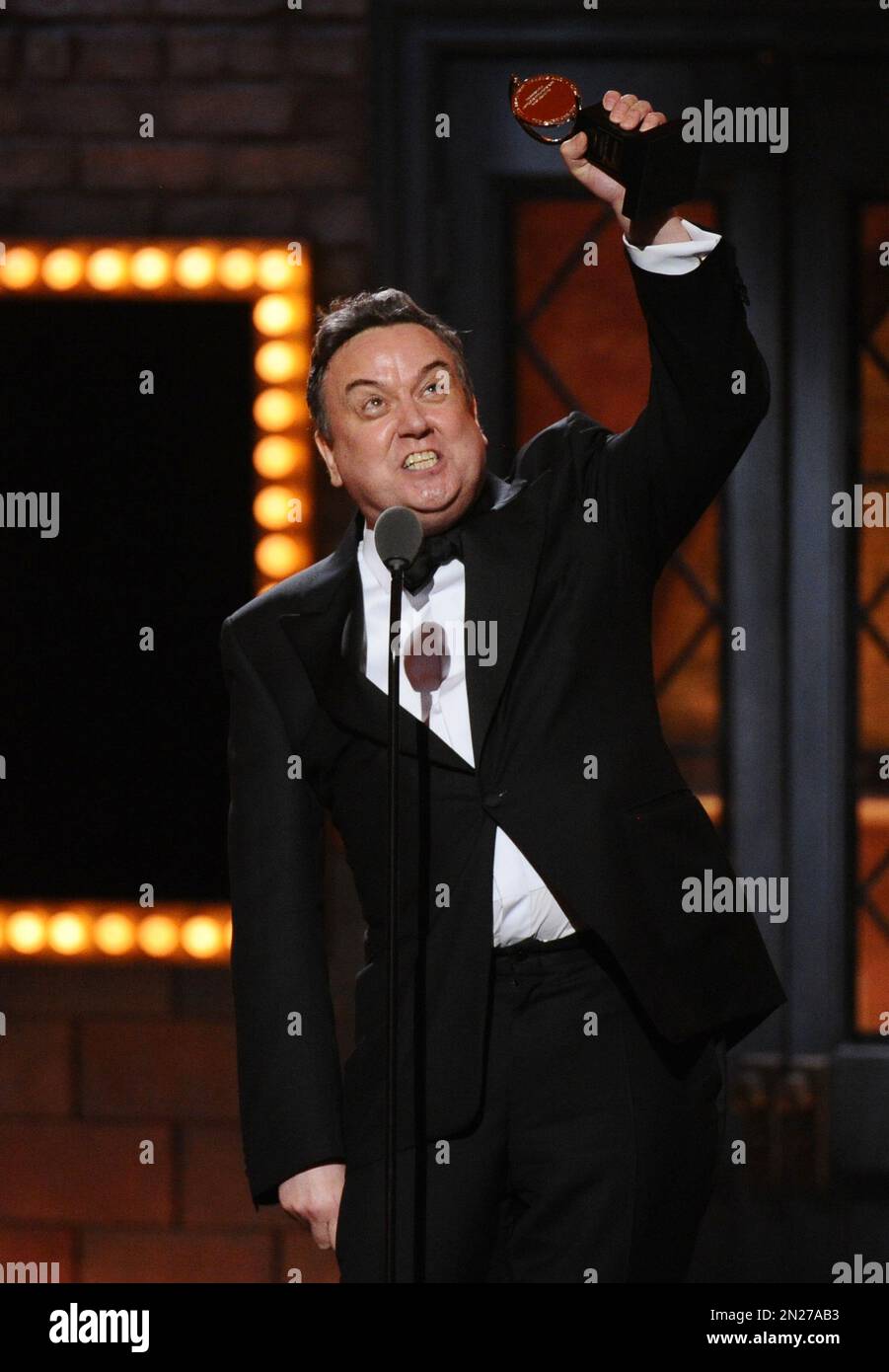 Richard McCabe accepts the award for best performance by an actor in a ...