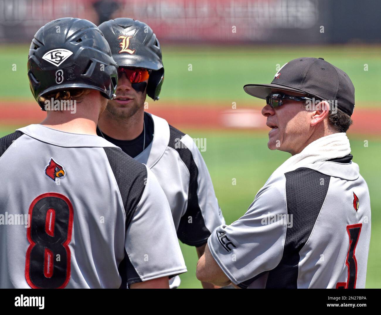Louisville head coach Dan McDonnell, right, talks with Danny Rosenbaum ...