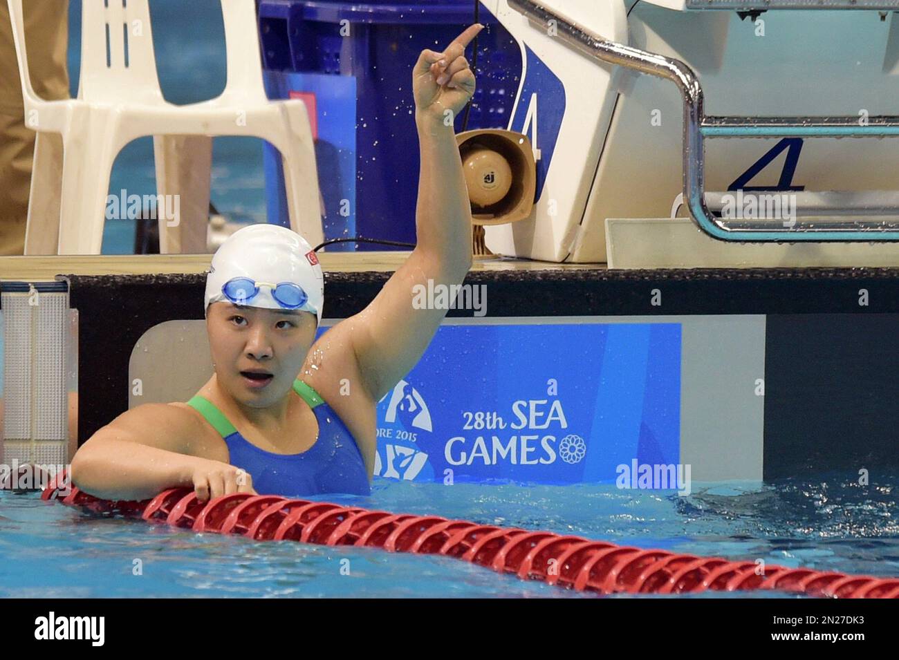 Singapore's Tao Li gestures to the crowd after she won the women's 50m ...