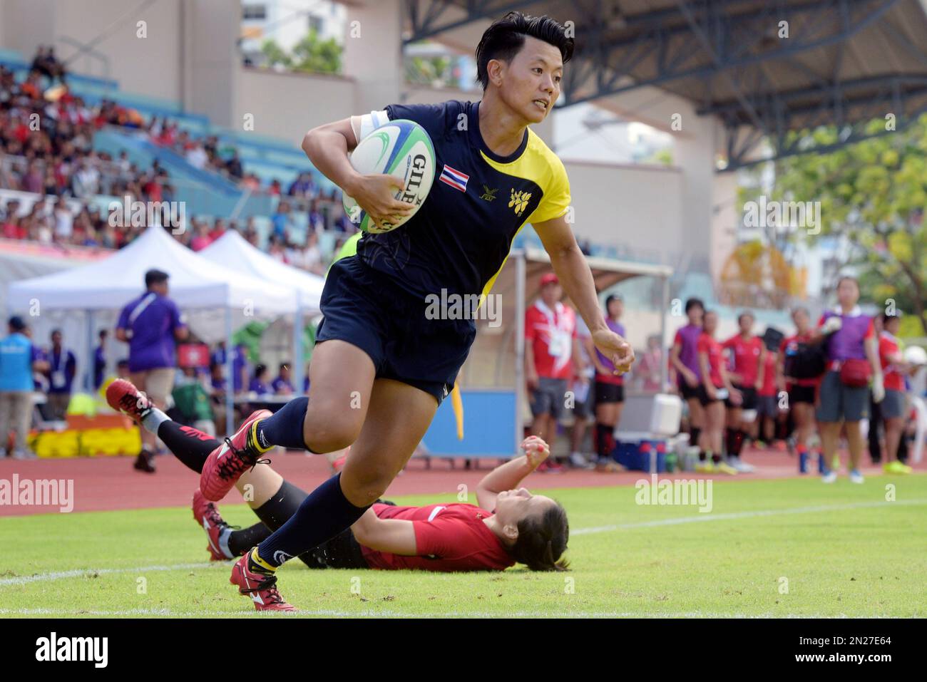 Yusri Chitchanok of Thailand scores her team's second try of the Rugby ...