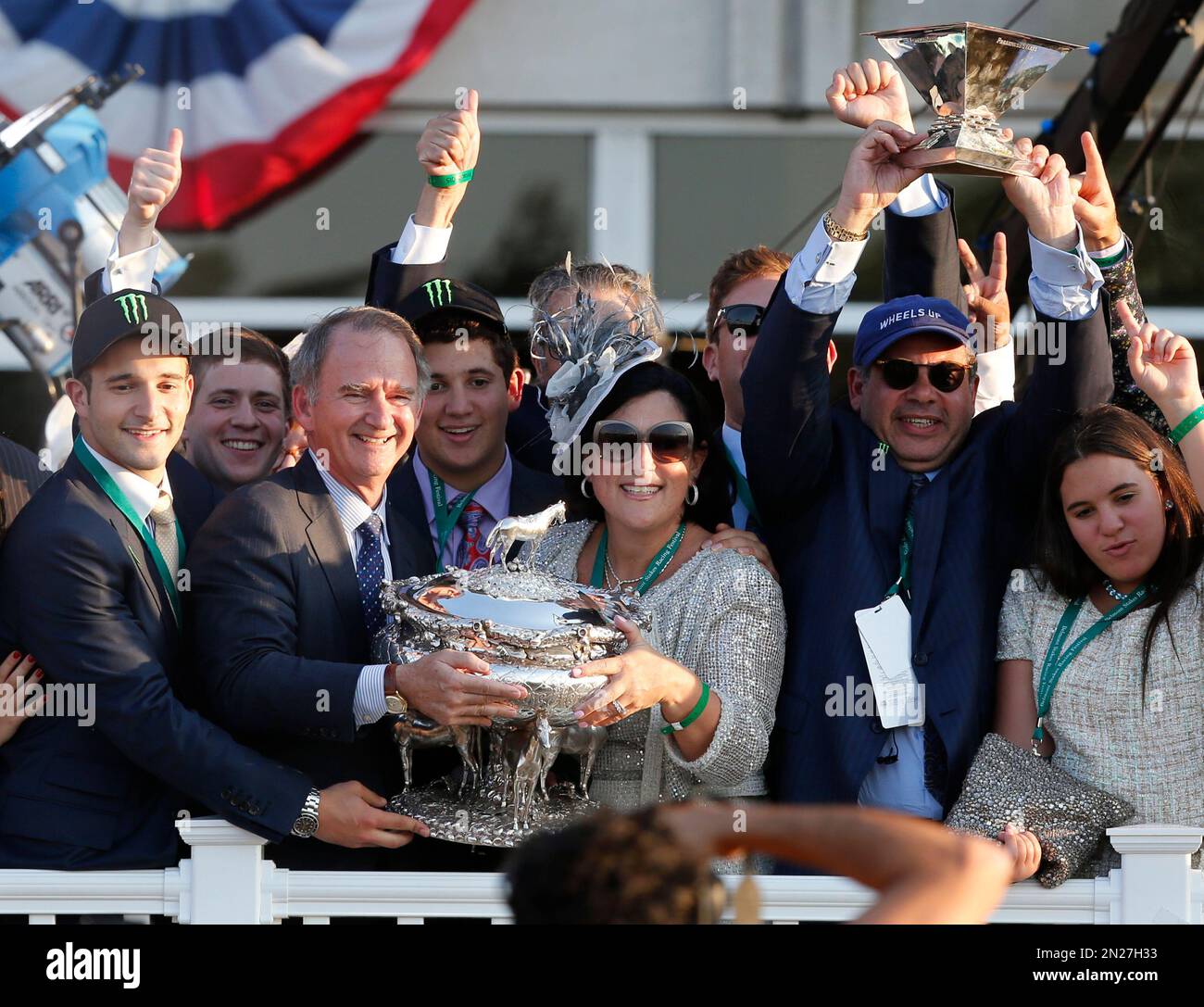 Ahmed Zayat, second from right, owner of American Pharoah, holds up the ...