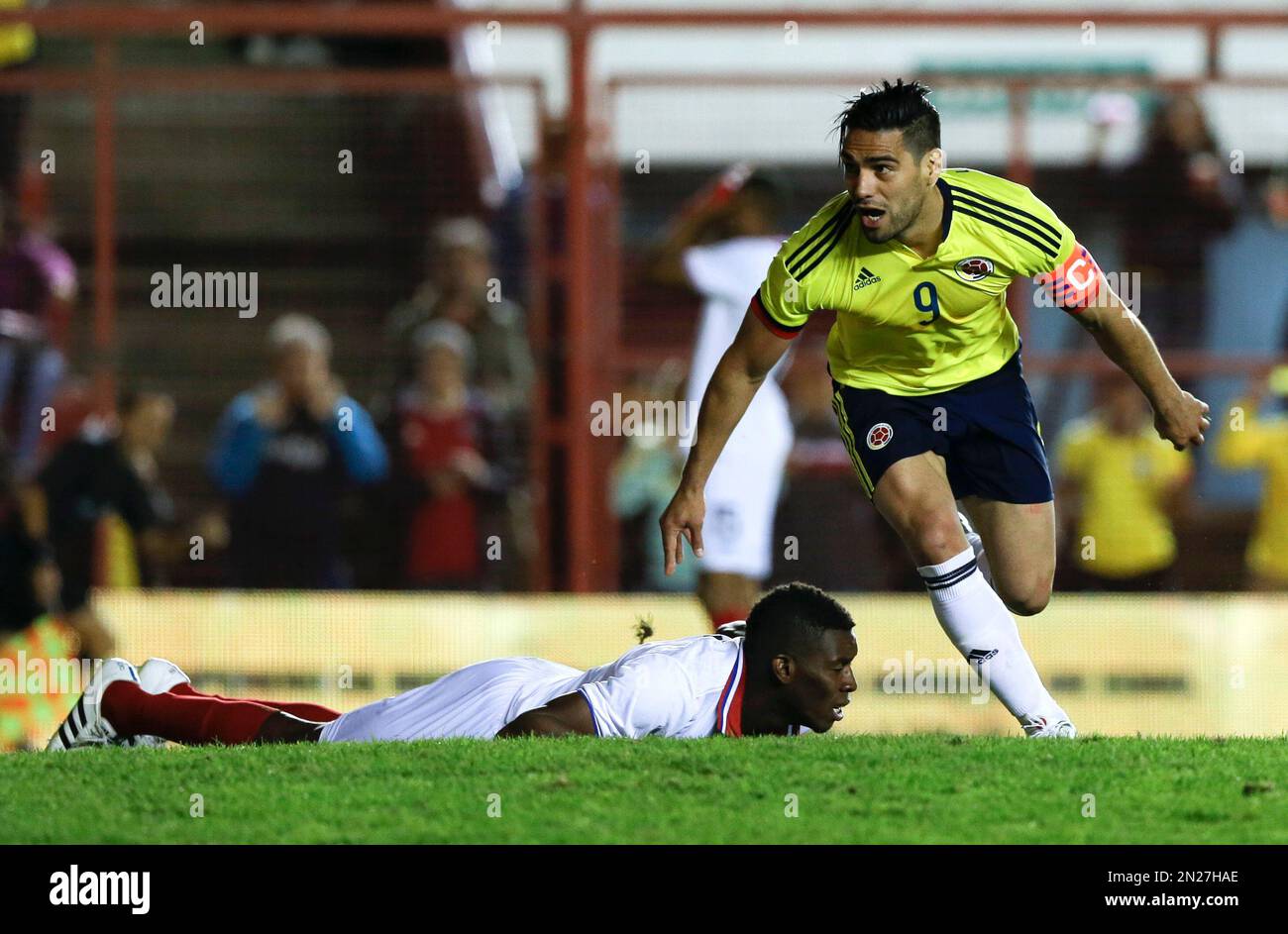 Colombia's Radamel Falcao Garcia celebrates scoring as he runs past a ...