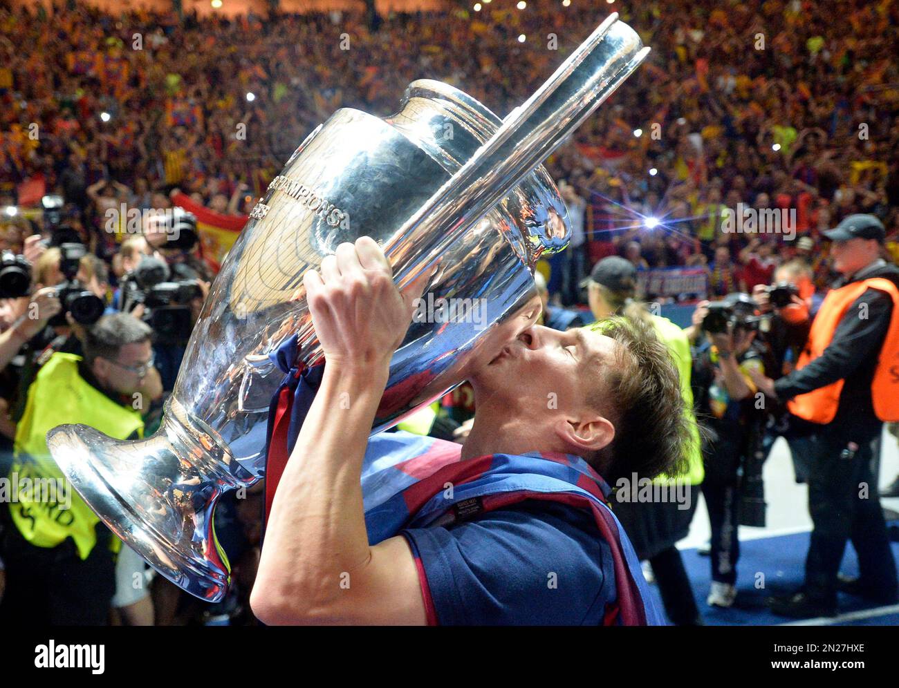 Barcelona's Lionel Messi kisses the trophy after winning 3-1 the ...