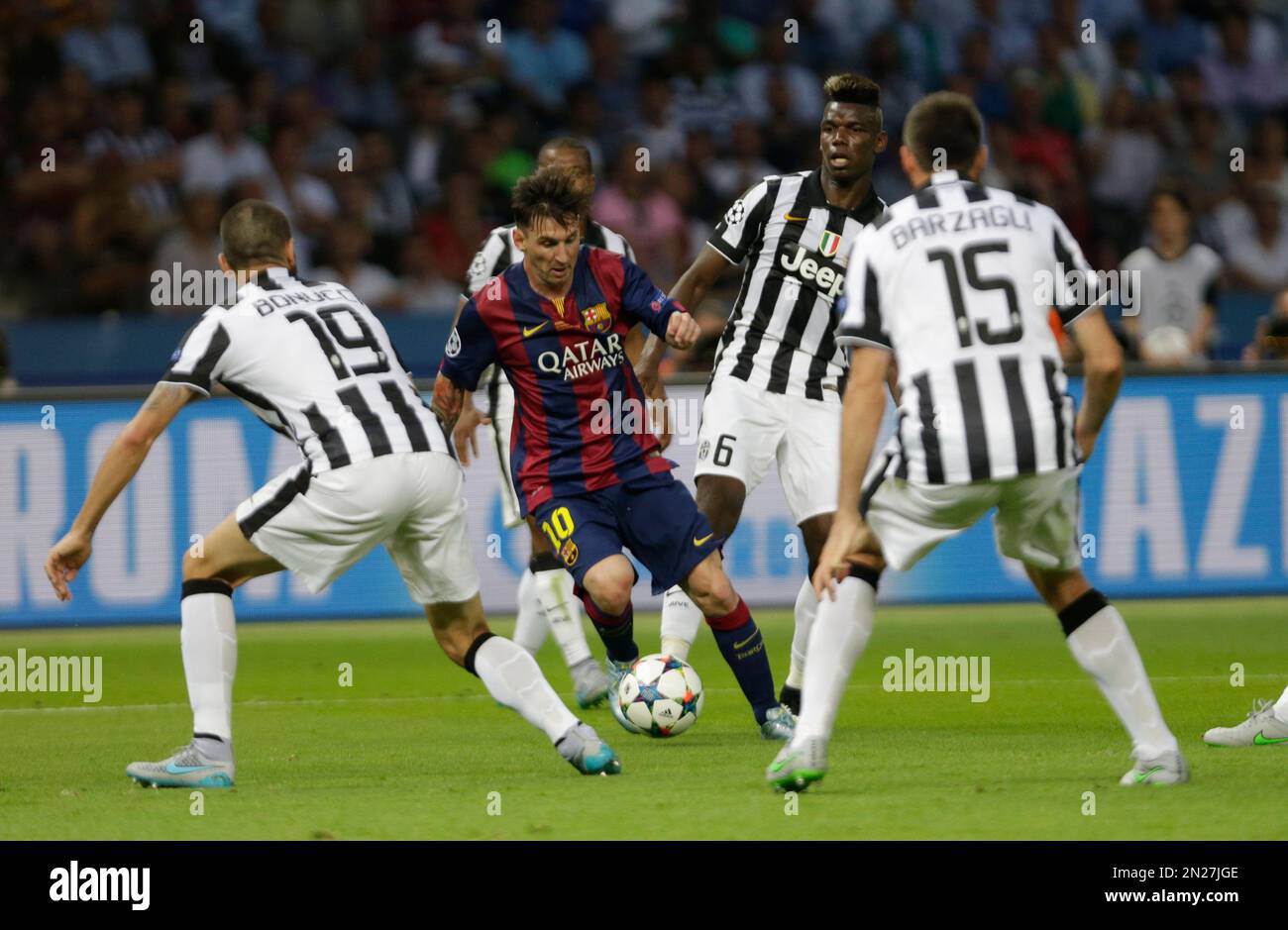 Barcelona's Lionel Messi, centre, takes on the Juventus defence during ...