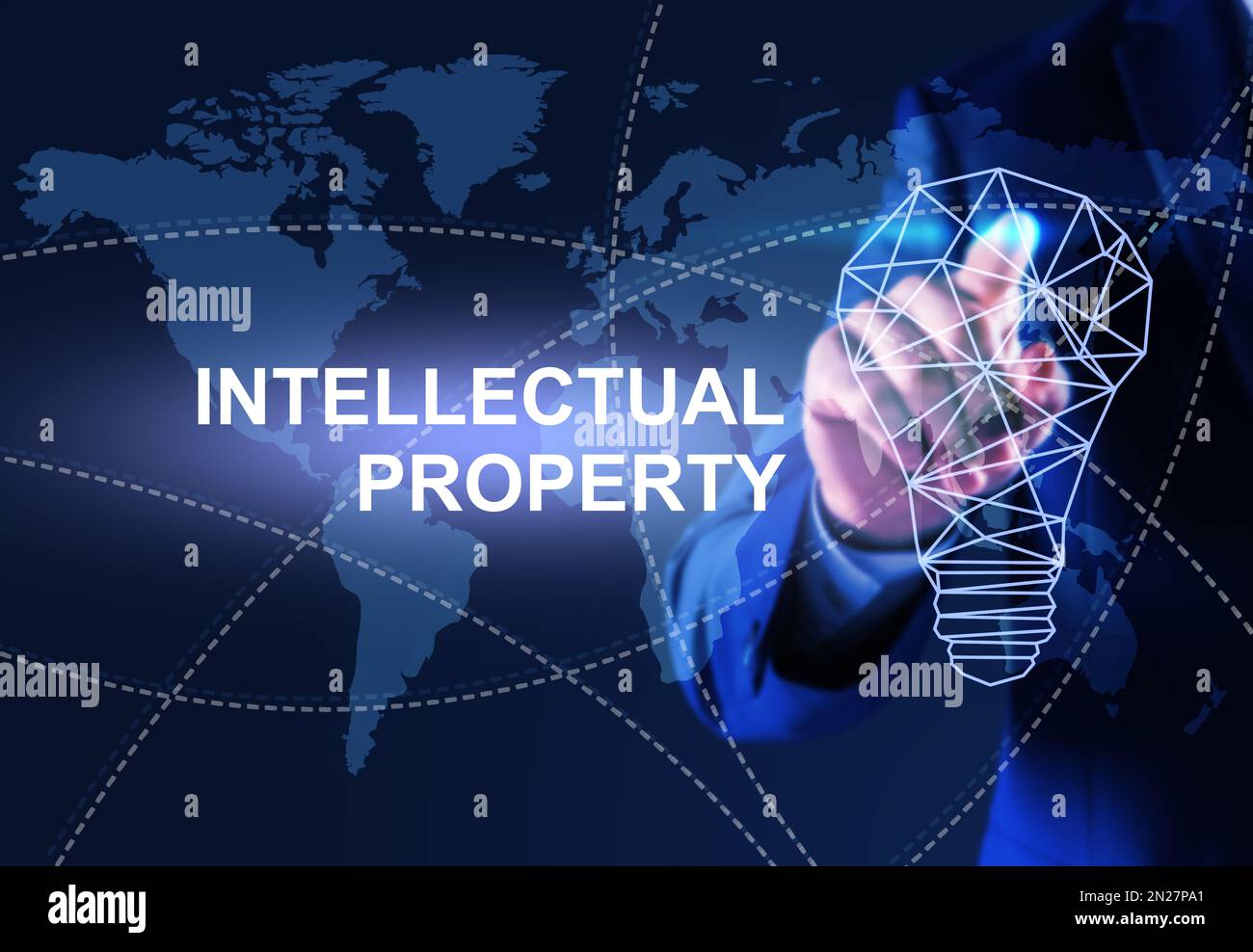 Intellectual property concept. Man using virtual screen with world map ...