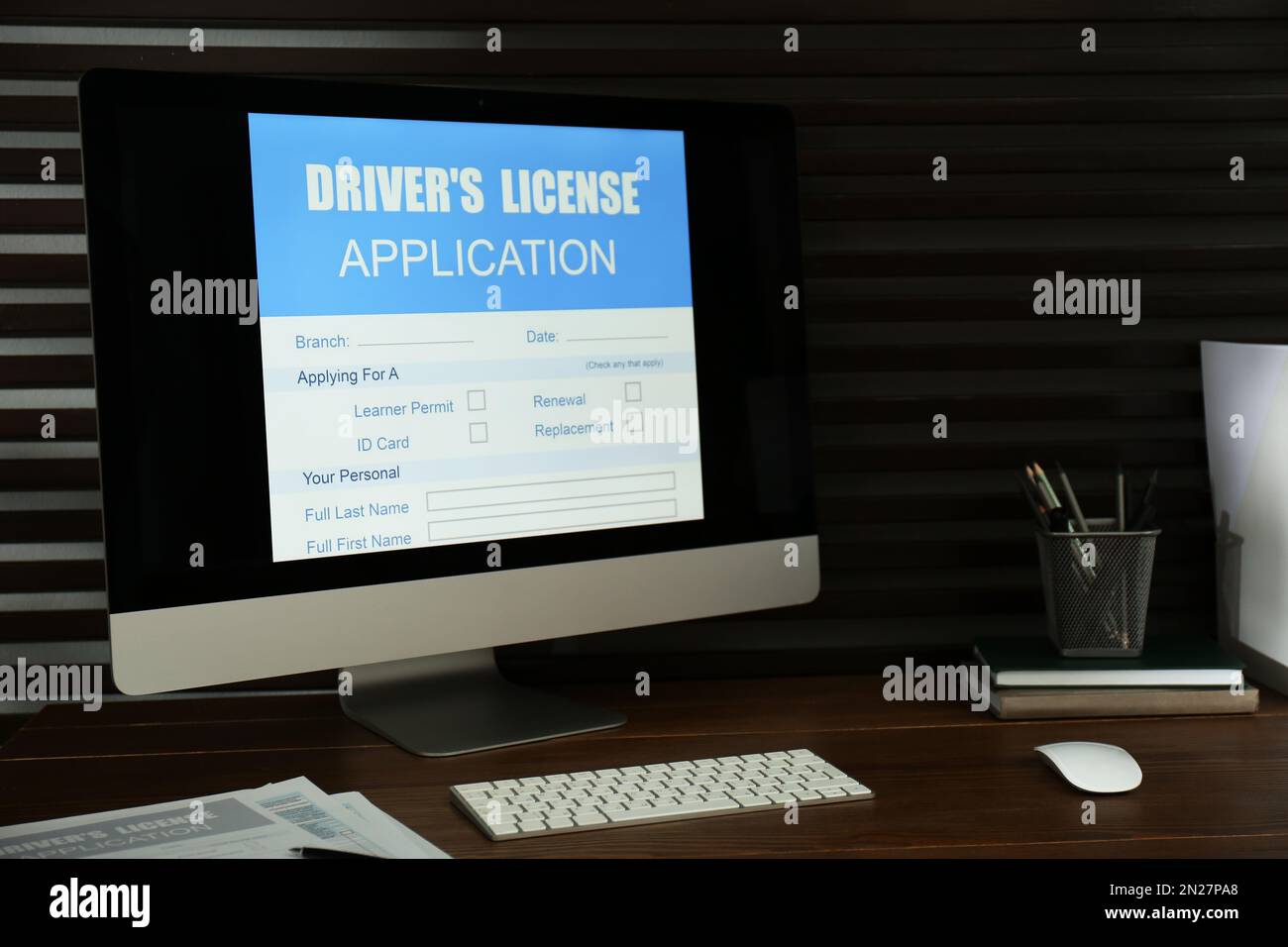 Computer with driver's license application form on table in office Stock Photo - Alamy