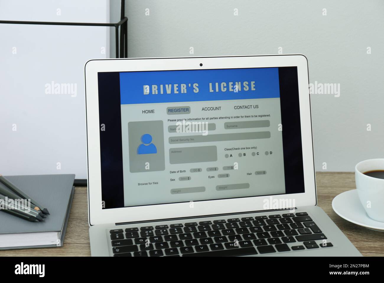 Laptop with driver's license application form on table in office Stock Photo - Alamy
