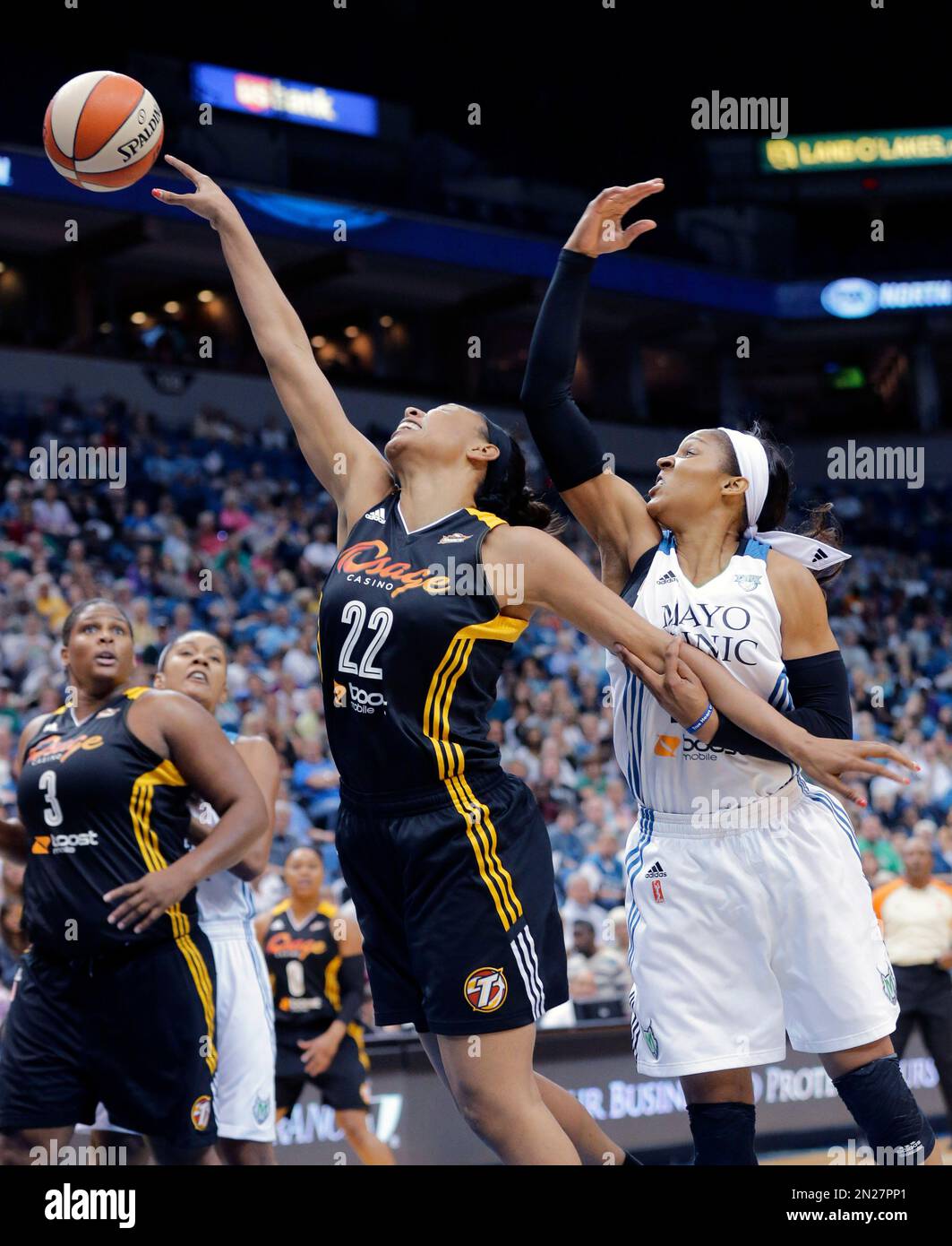 Tulsa Shock forward Plenette Pierson, left, and Minnesota Lynx forward ...