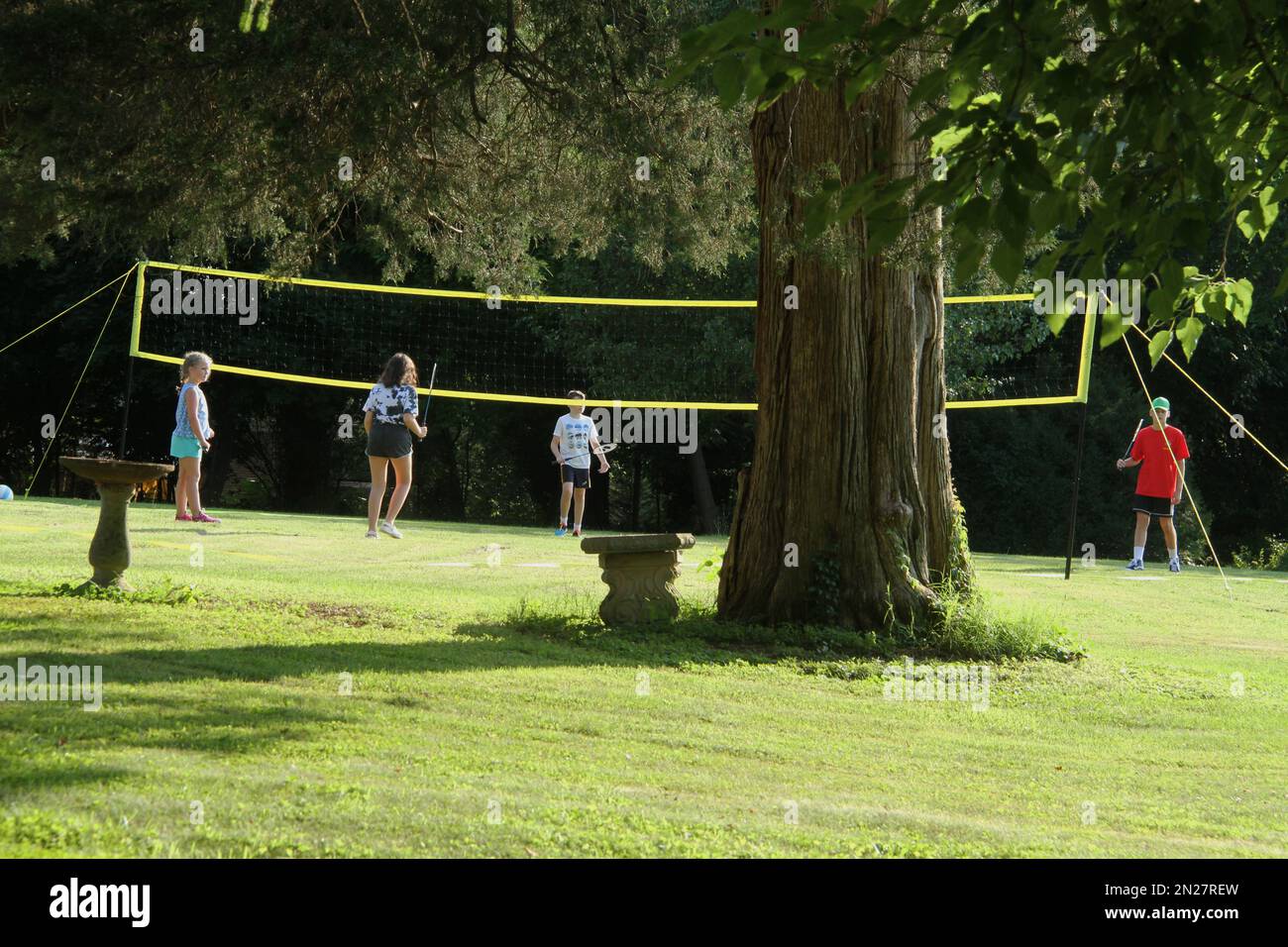 Virginia, USA. Children playing badminton in a yard Stock Photo - Alamy