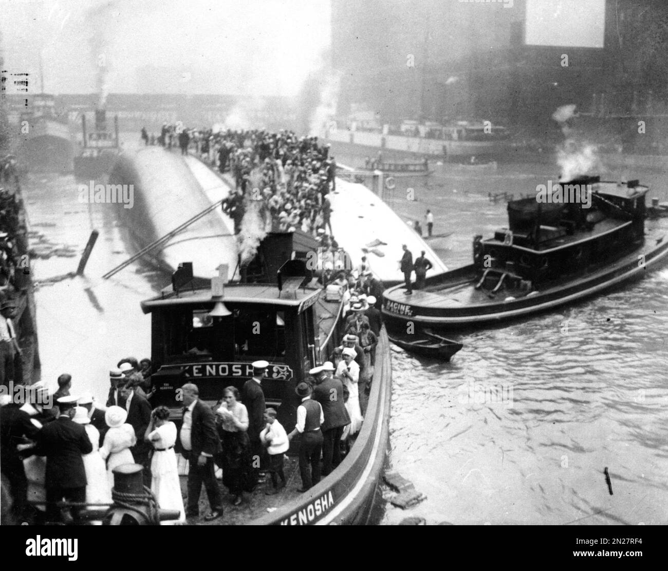 FILE - In this July 24, 1915 file photo, passengers are rescued as they ...