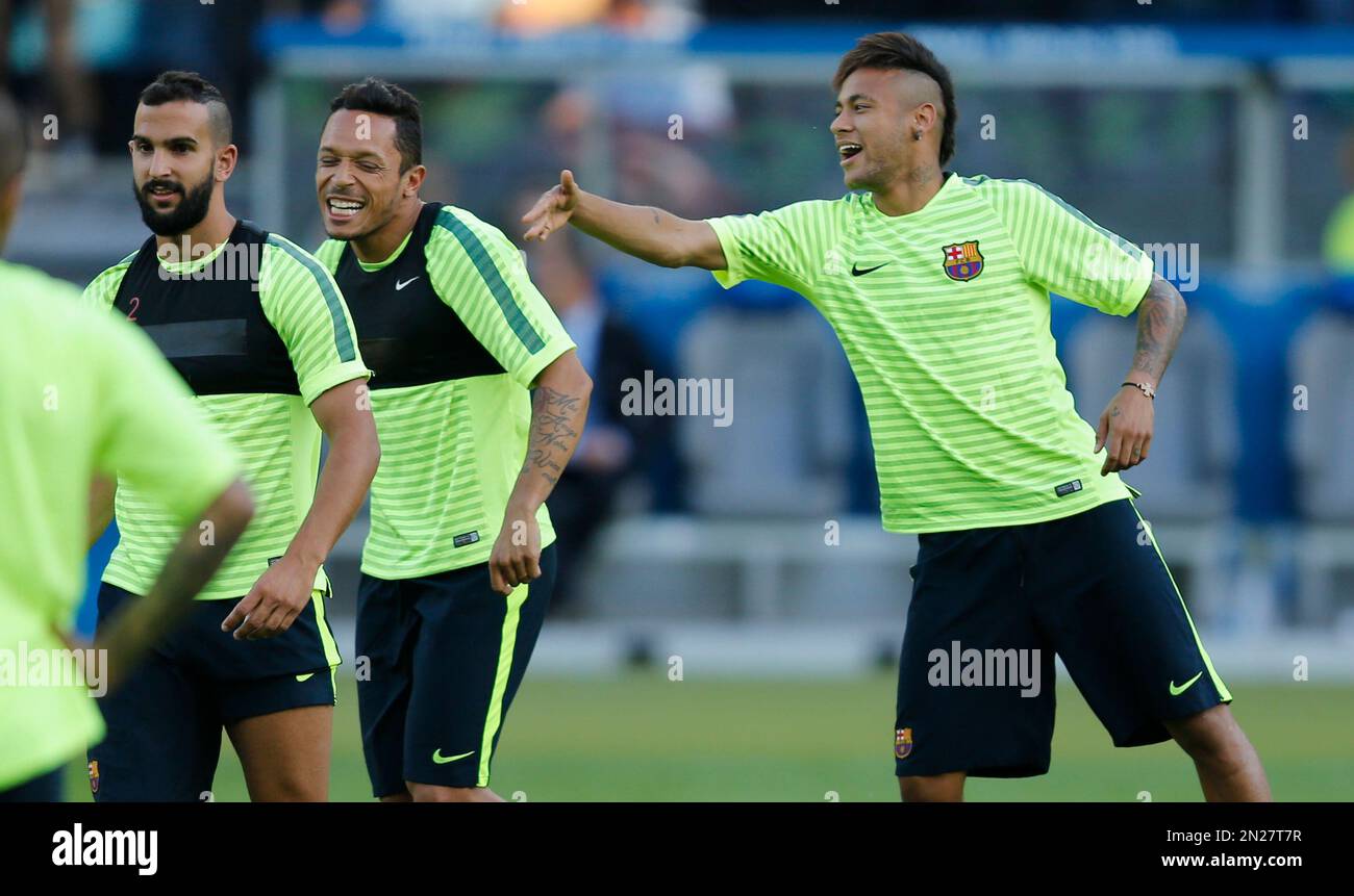 Barcelona's Martin Montoya, Adriano Correia and Neymar, from left, joke ...