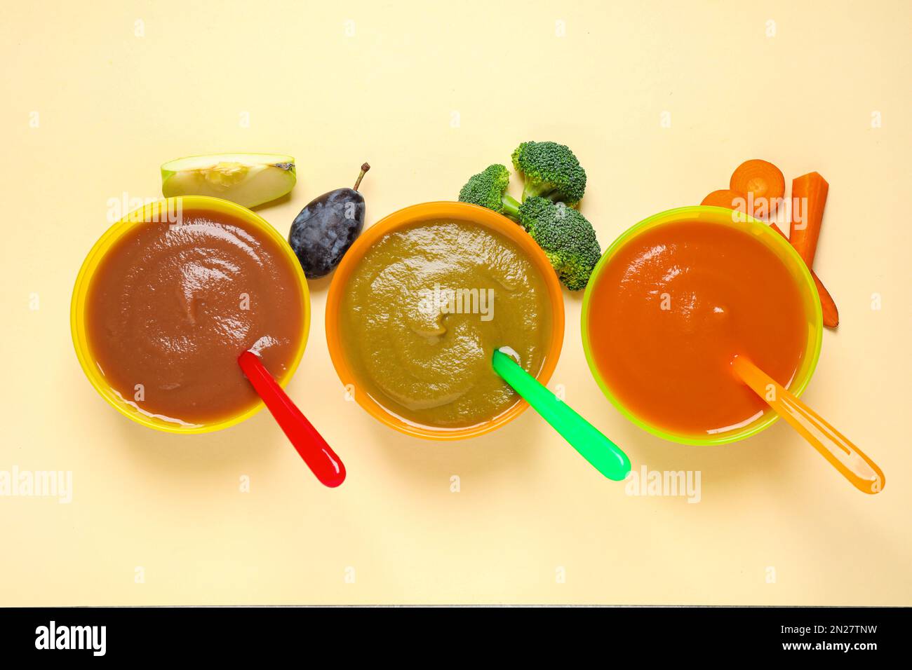 Healthy baby food and ingredients on yellow background, flat lay Stock ...