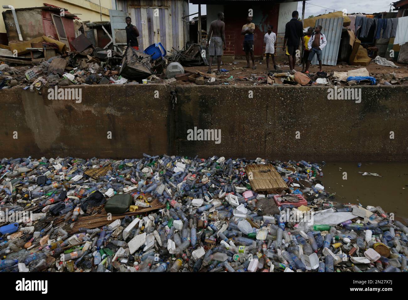 People view debris following flash floods in Accra, Ghana, Friday, June ...