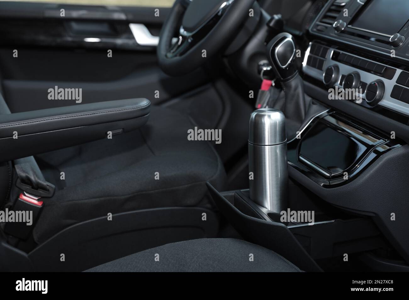 Silver thermos in holder inside of car Stock Photo - Alamy