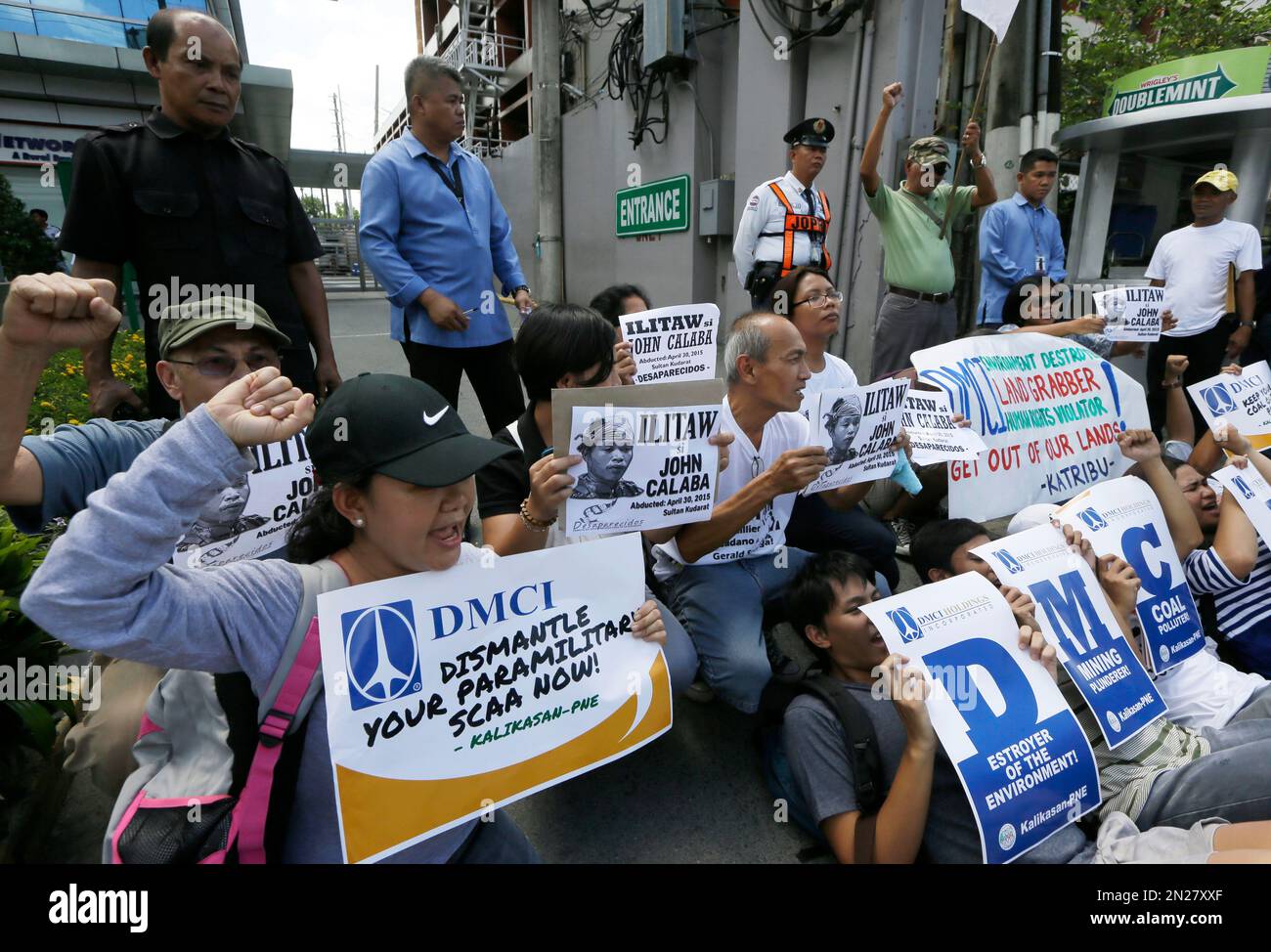 Protesters shout slogans during a rally outside the DMCI, a ...