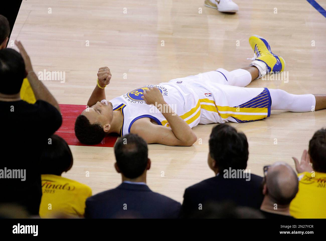 Golden State Warriors guard Stephen Curry (30) lays on the floor during ...