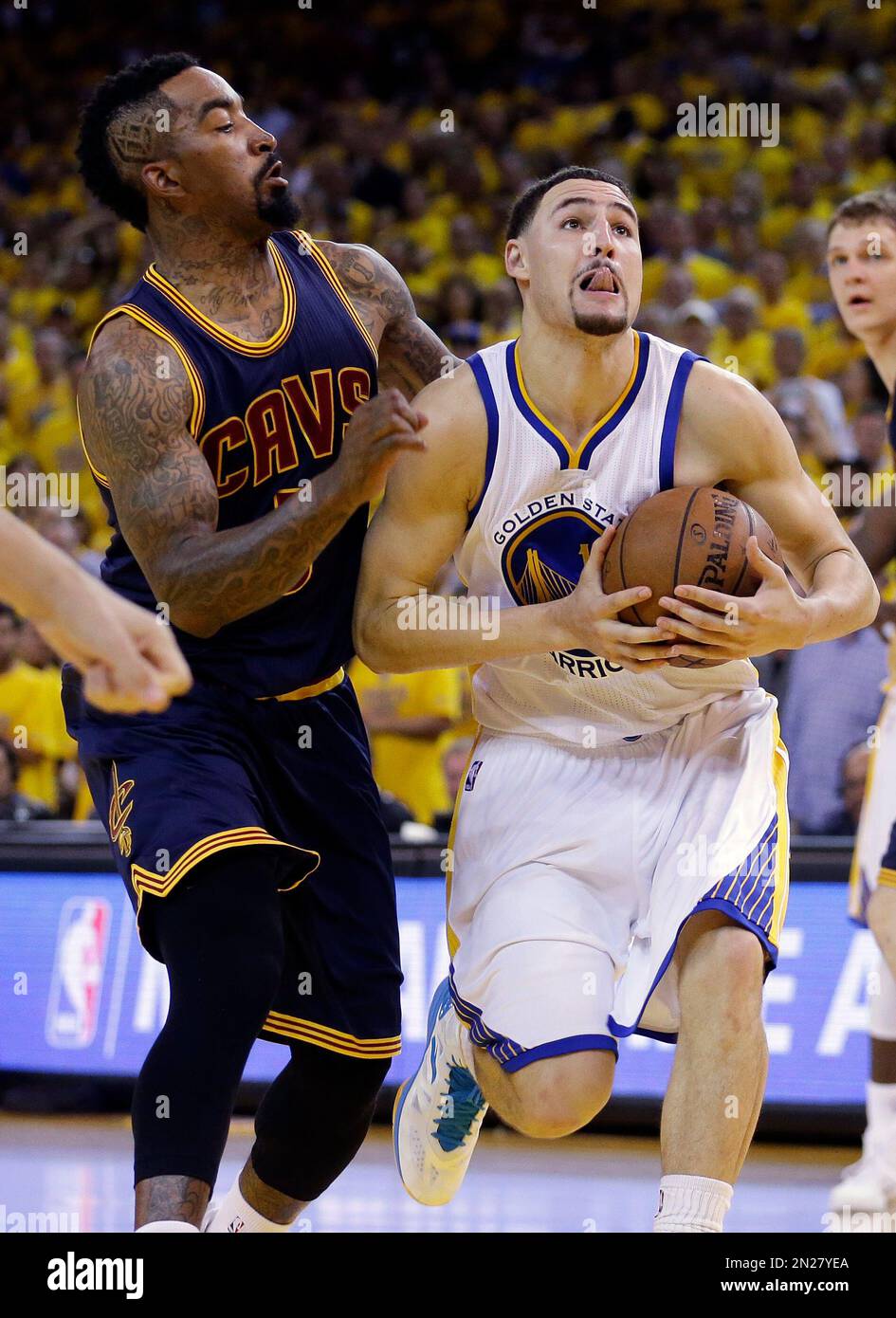 Golden State Warriors guard Klay Thompson, right, shoots against ...