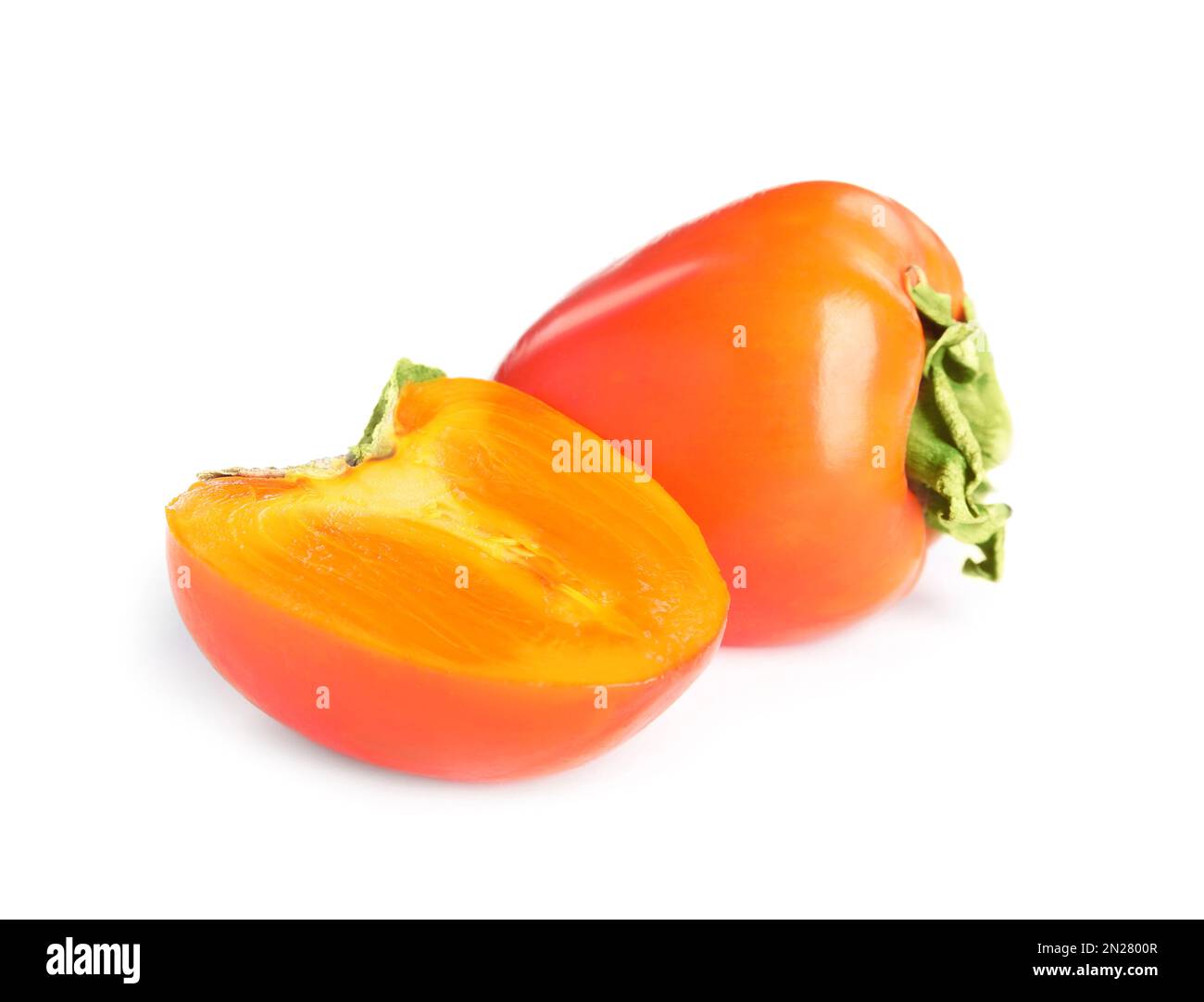 Whole cut fresh persimmons hi-res stock photography and images - Alamy