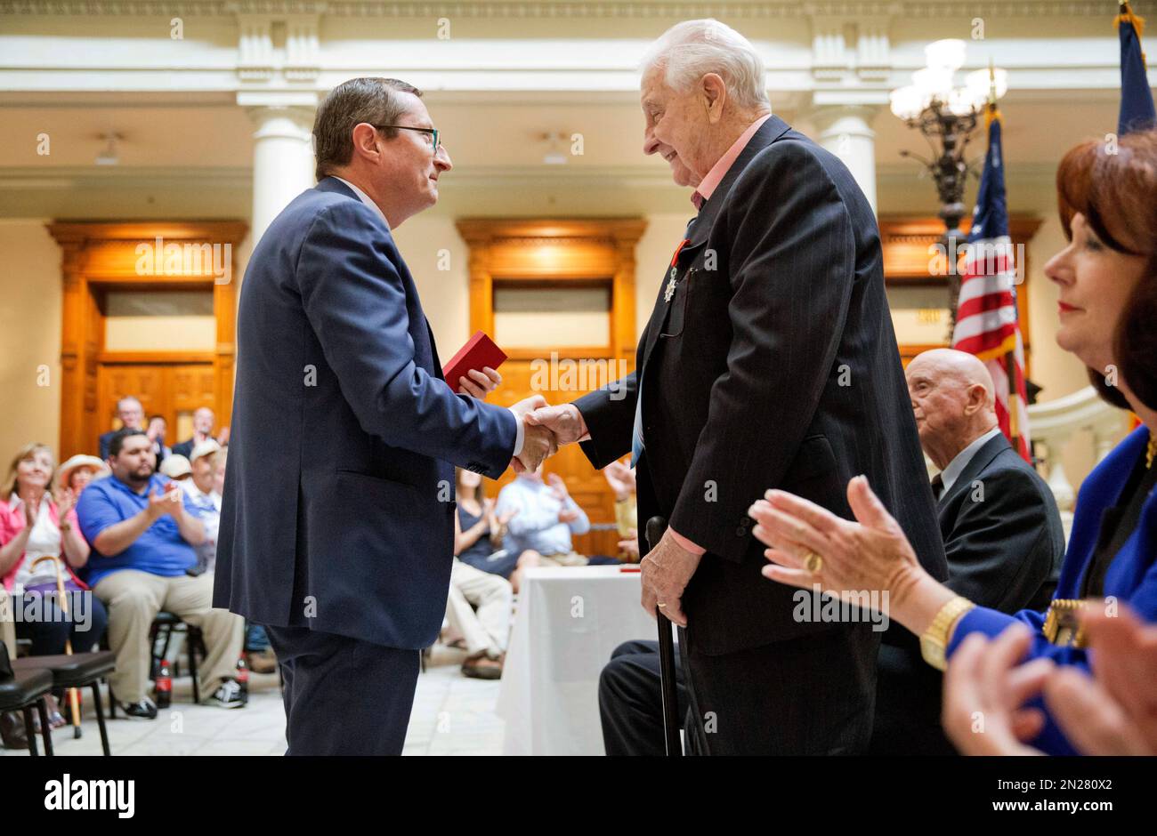 World War II veteran Fred Moston, 92, of Snellville, Ga., right ...