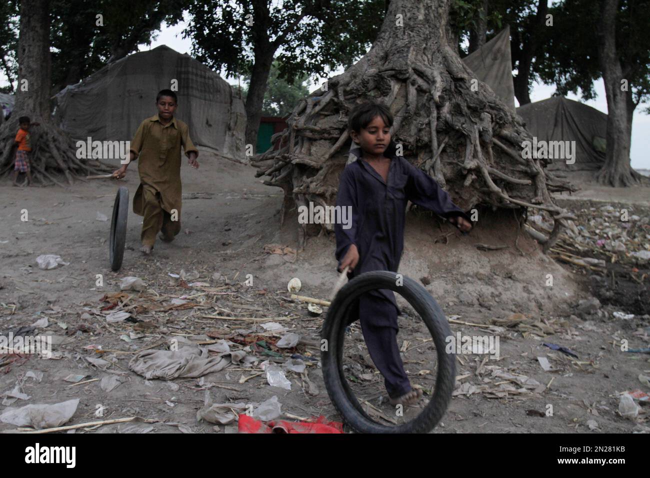 Pakistani children play in Lahore's slums, Thursday, June 4, 2015 in ...