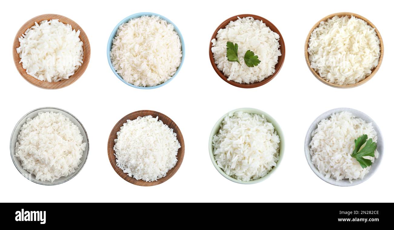 Set of bowls with cooked rice isolated on white, top view. Banner ...