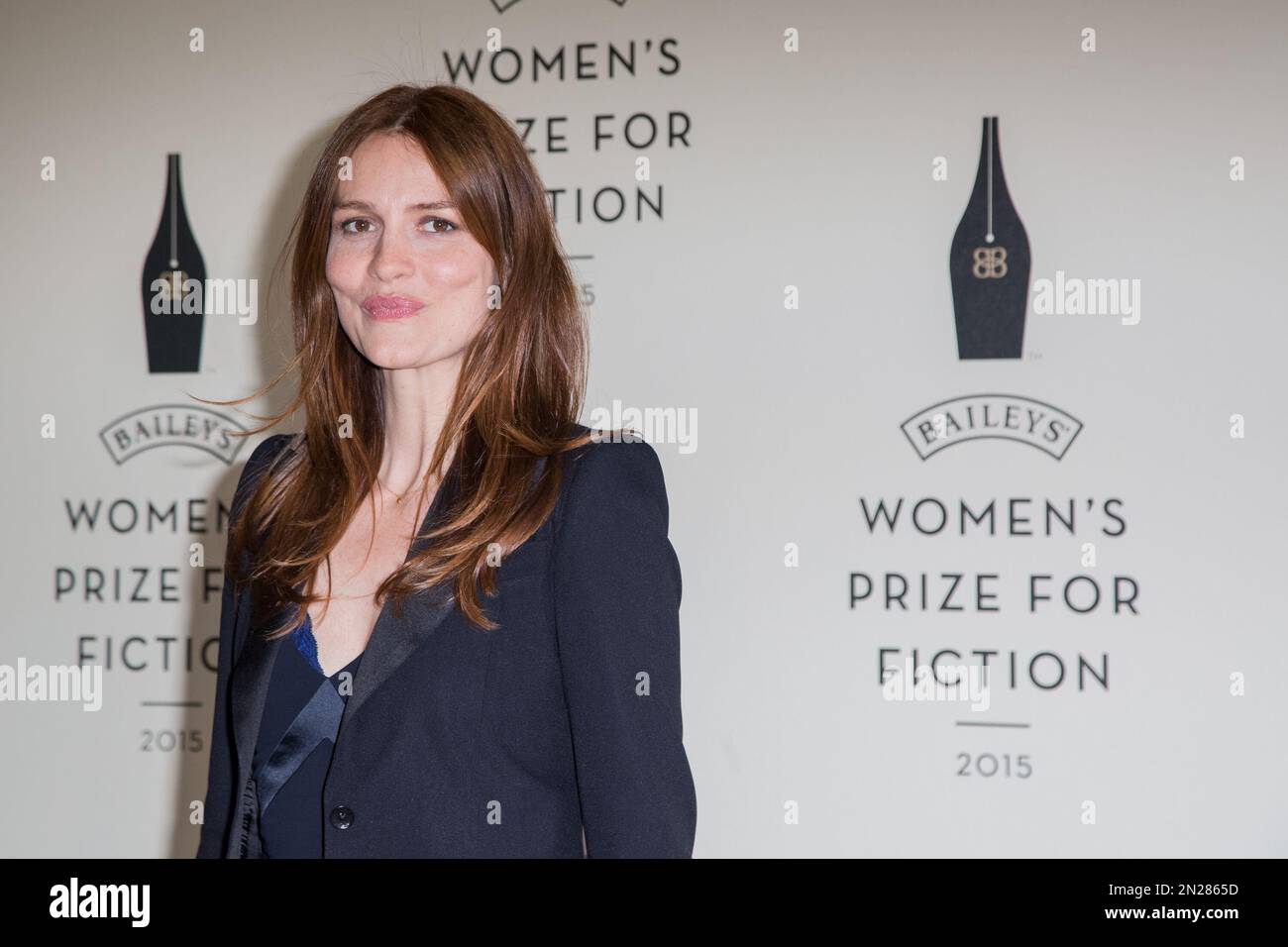 Saffron Burrows poses for photographers upon arrival at the Bailey ...