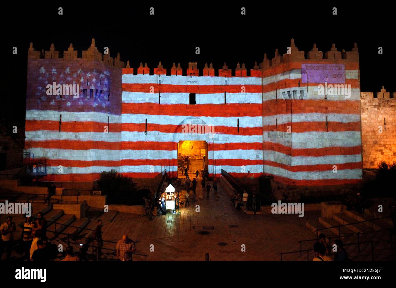 A light installation is projected onto the Damascus gate during a ...