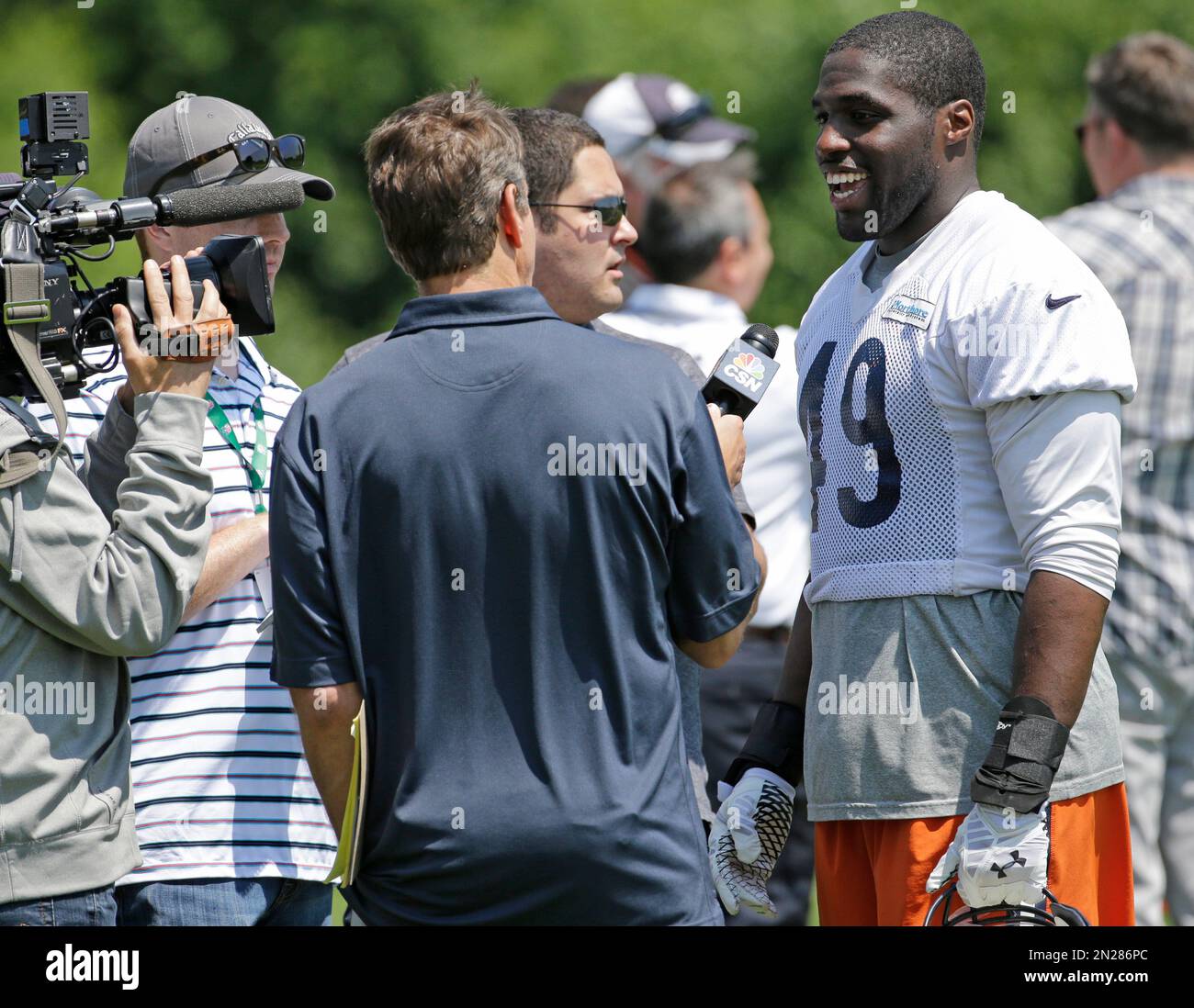 Chicago Bears linebacker Sam Acho, right, talks to the media after an ...