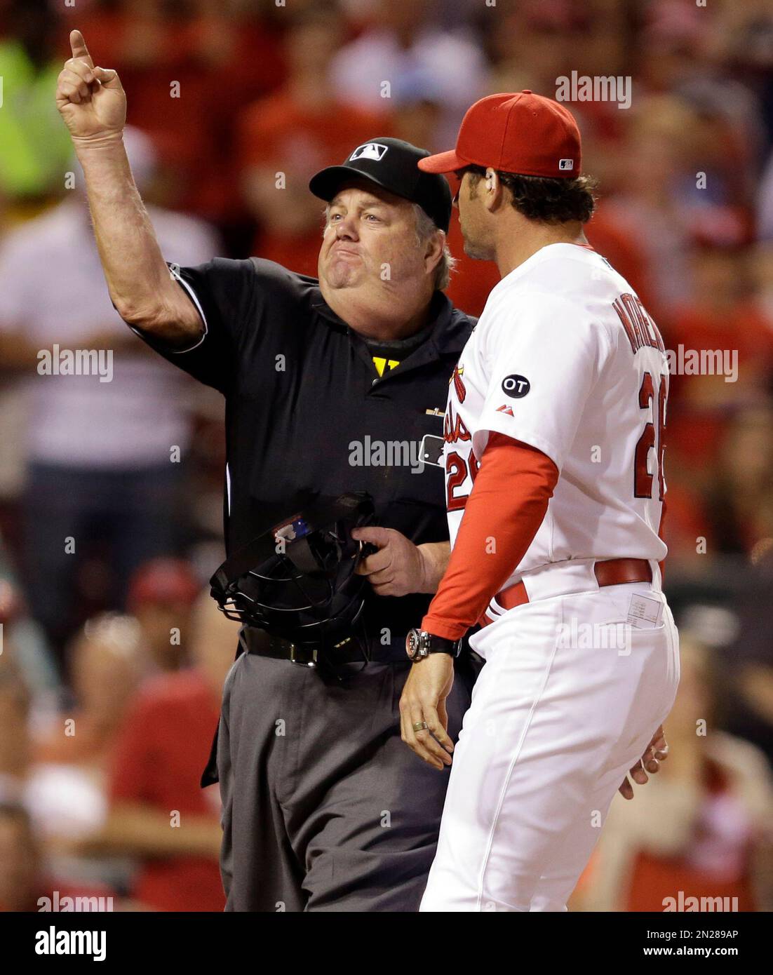 Home plate umpire Joe West, left, throws St. Louis Cardinals manager ...