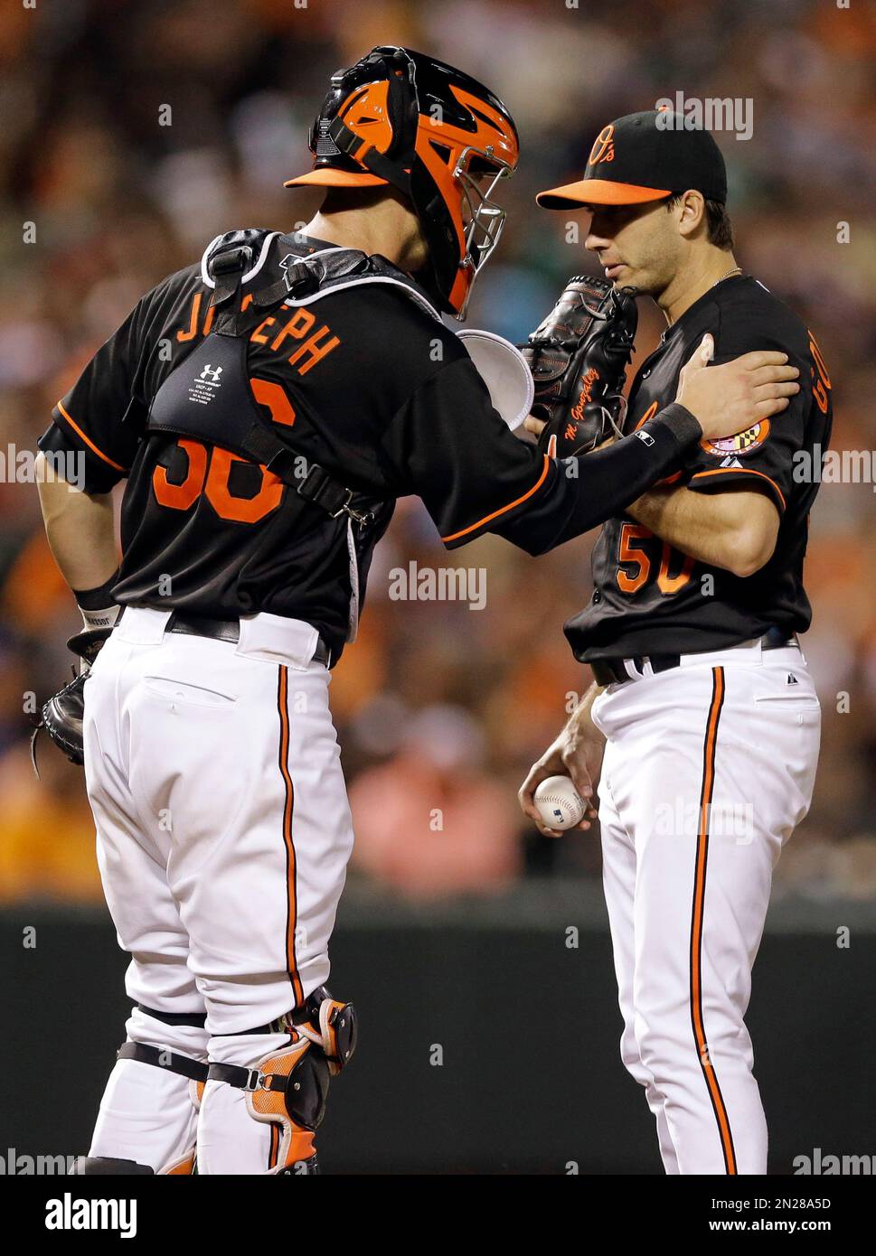 Baltimore Orioles catcher Caleb Joseph, left, chats with starting ...