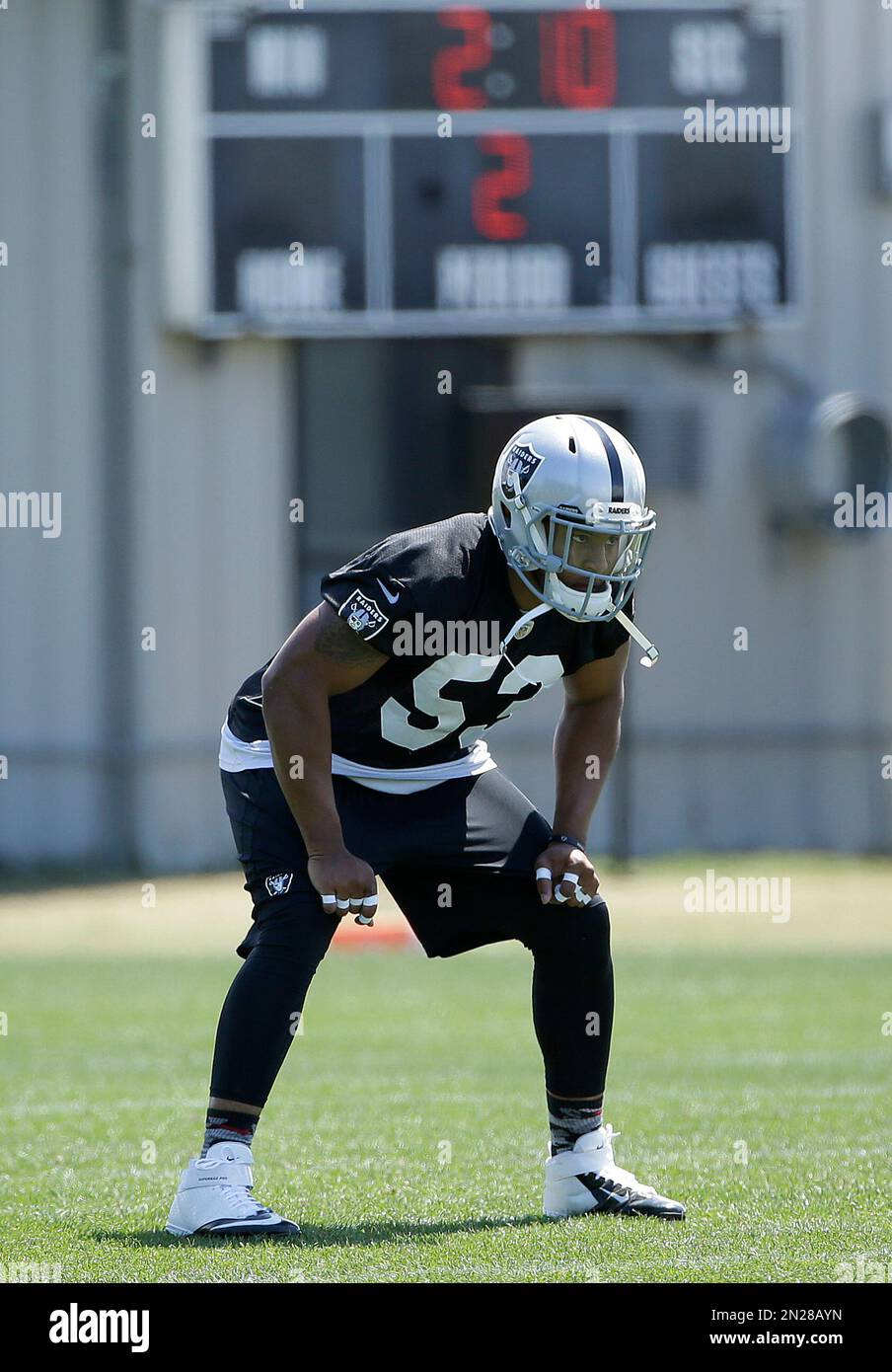 Oakland Raiders linebacker Malcolm Smith stands on the field during ...