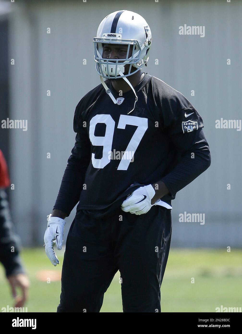 Oakland Raiders defensive end Mario Edwards Jr. walks on the field ...