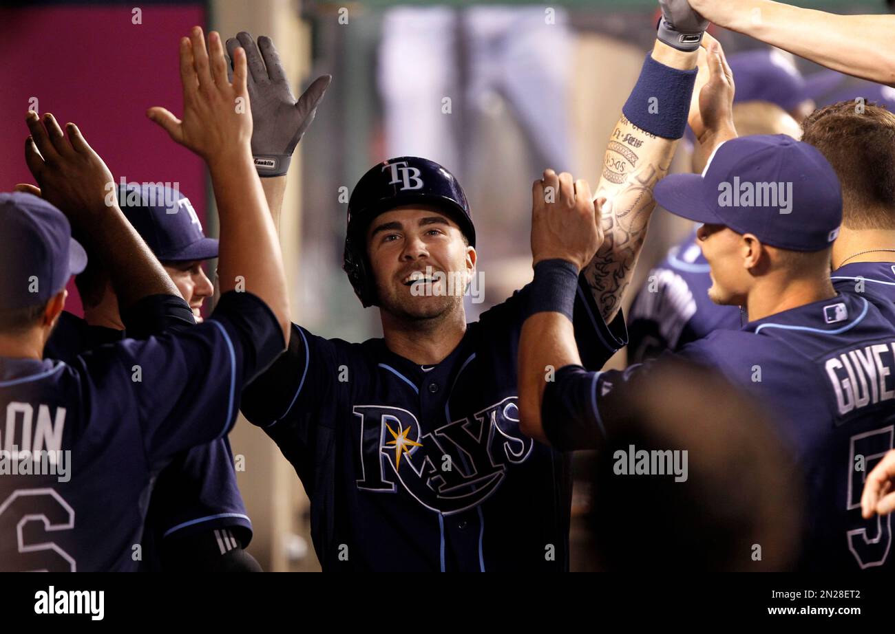 Tampa Bay Rays’ Nick Franklin, center, gets high-fives from teammates ...