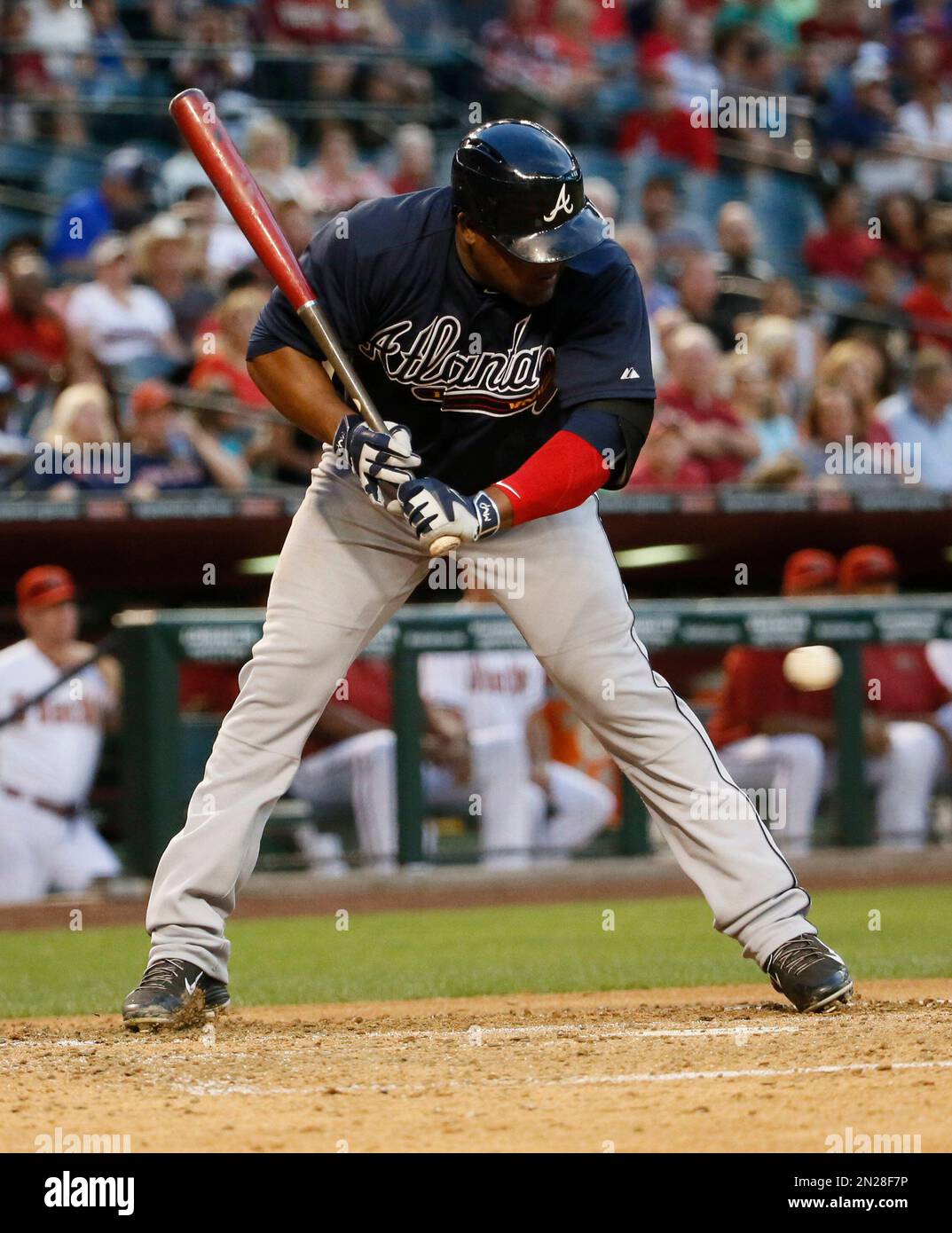 Atlanta Braves' Juan Uribe is hit by a pitch against the Arizona ...