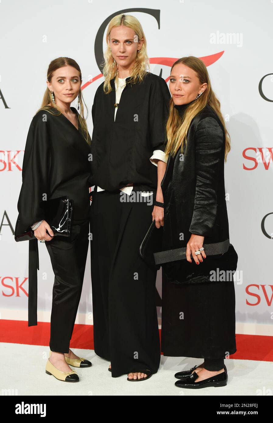 Ashley Olsen, left, designer Aymeline Valade and Mary-Kate Olsen arrive ...